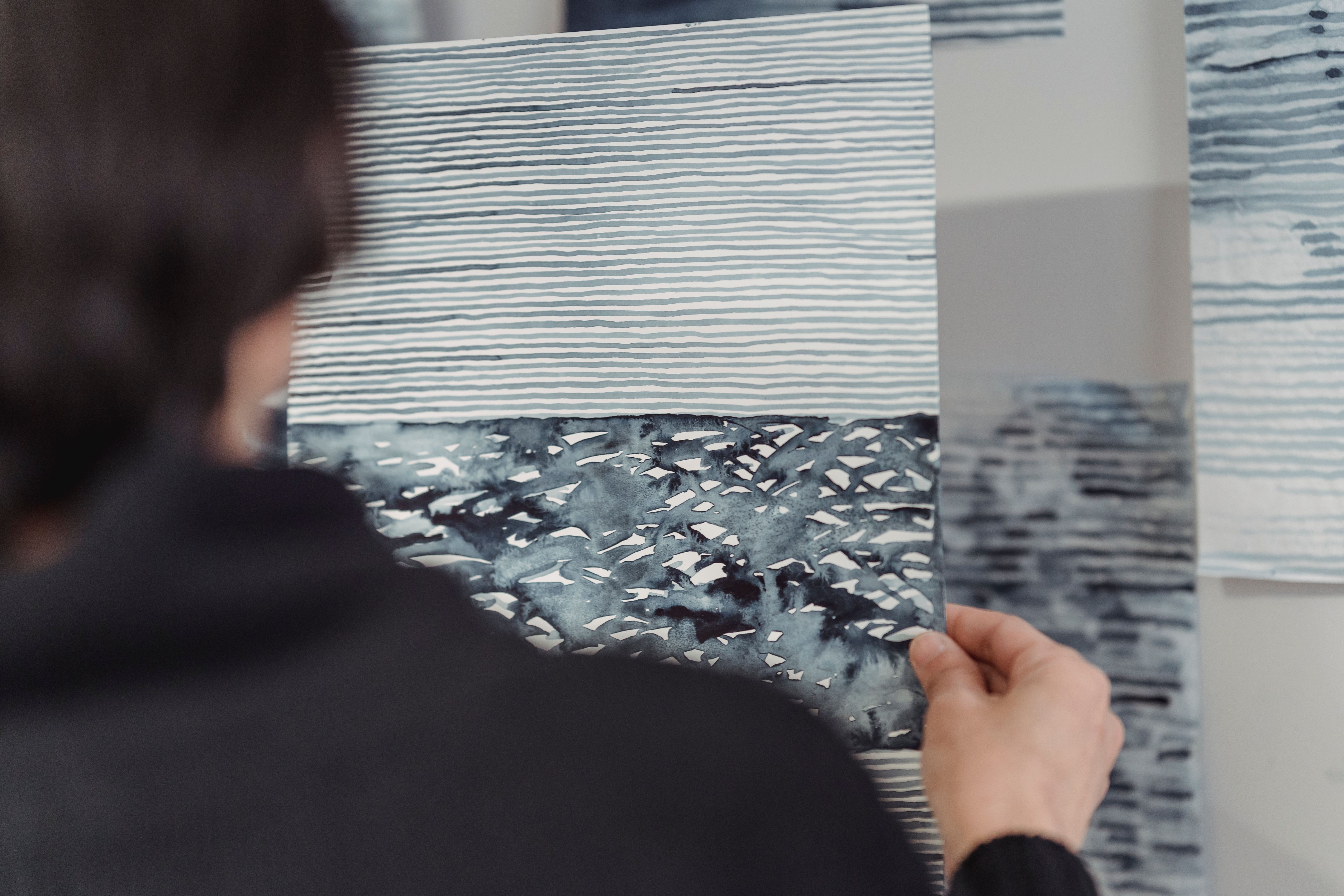 Person Looking at an Abstract Painting · Free Stock Photo