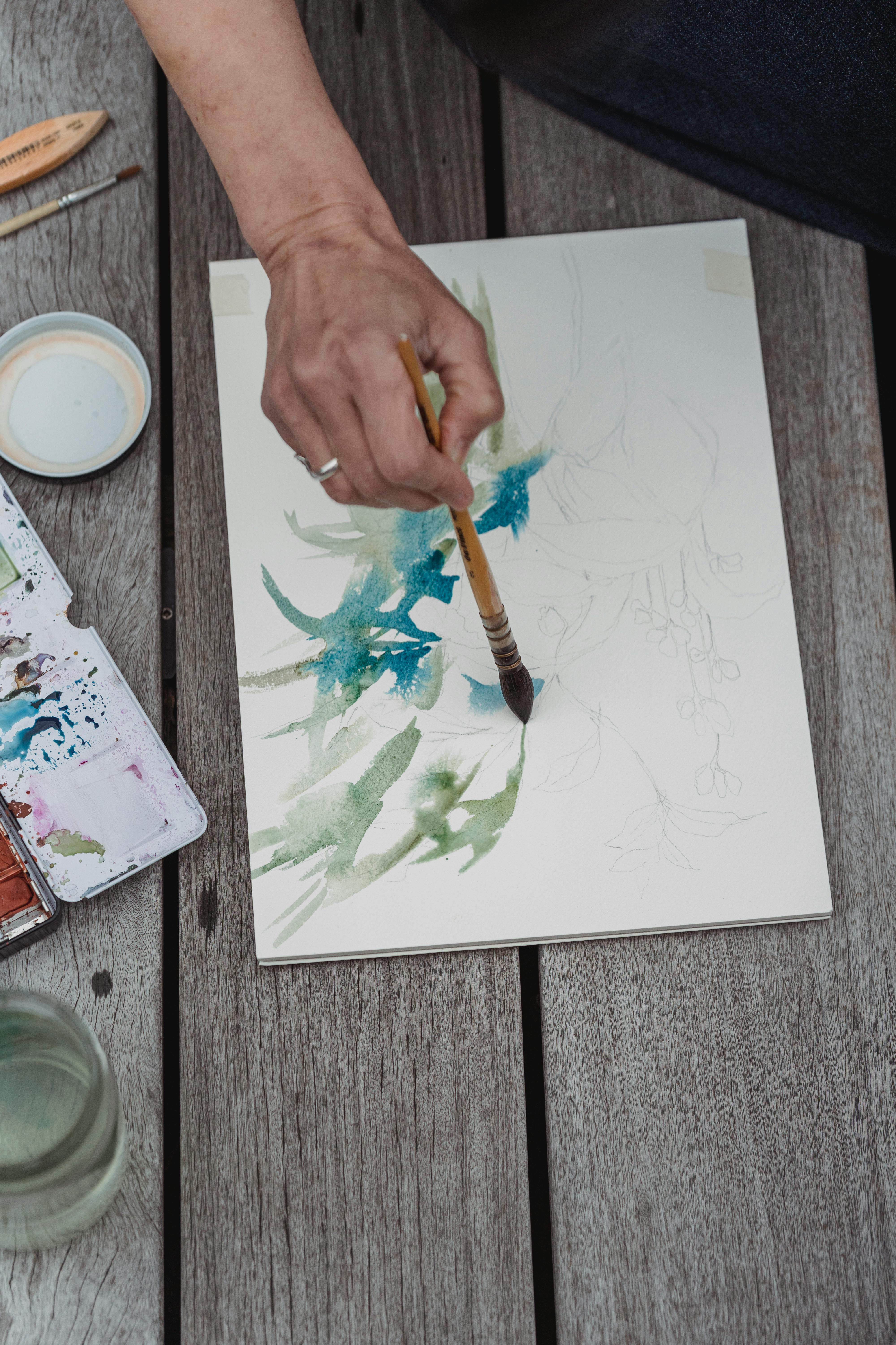 Person Painting an Artwork · Free Stock Photo