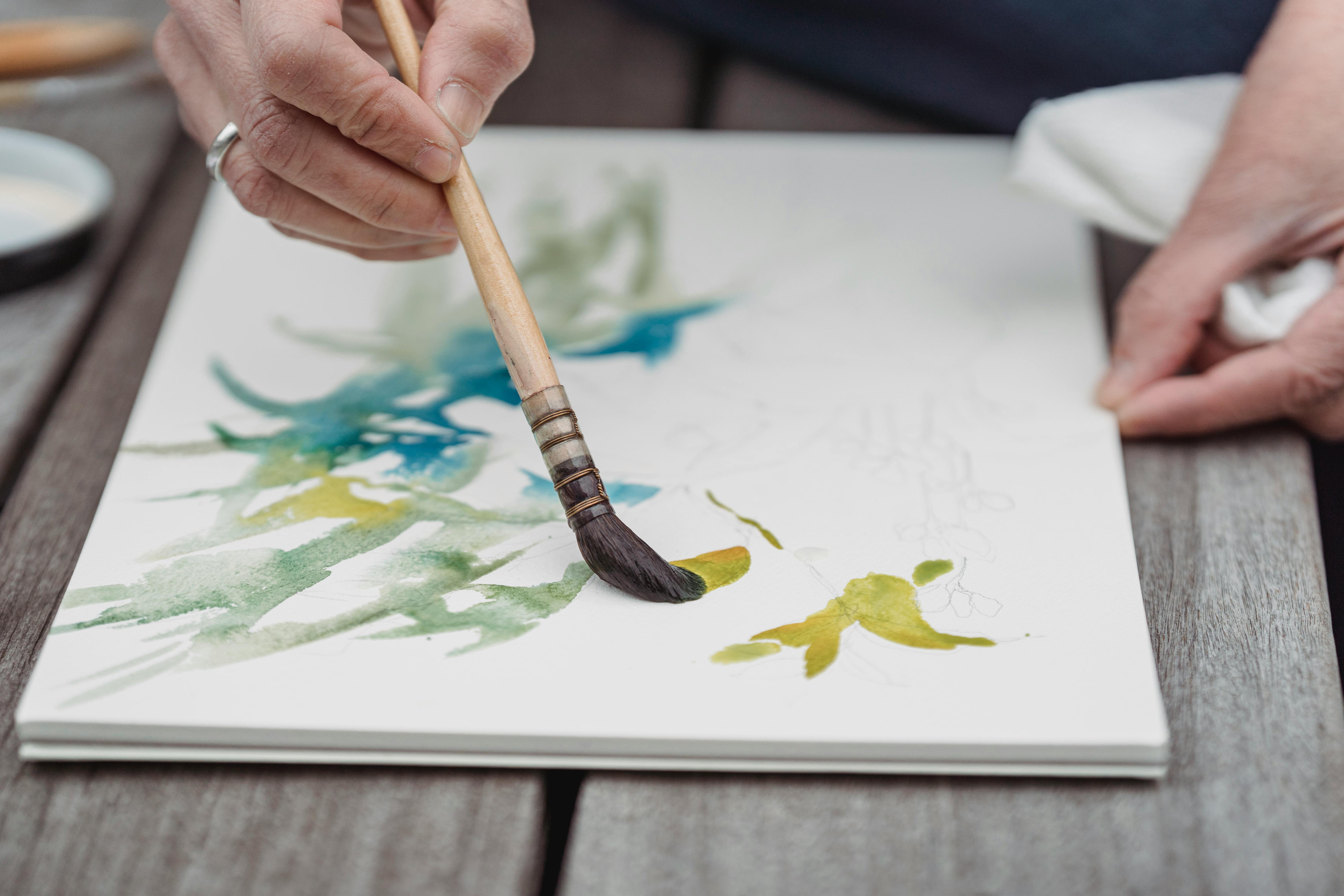 Person Painting an Artwork · Free Stock Photo