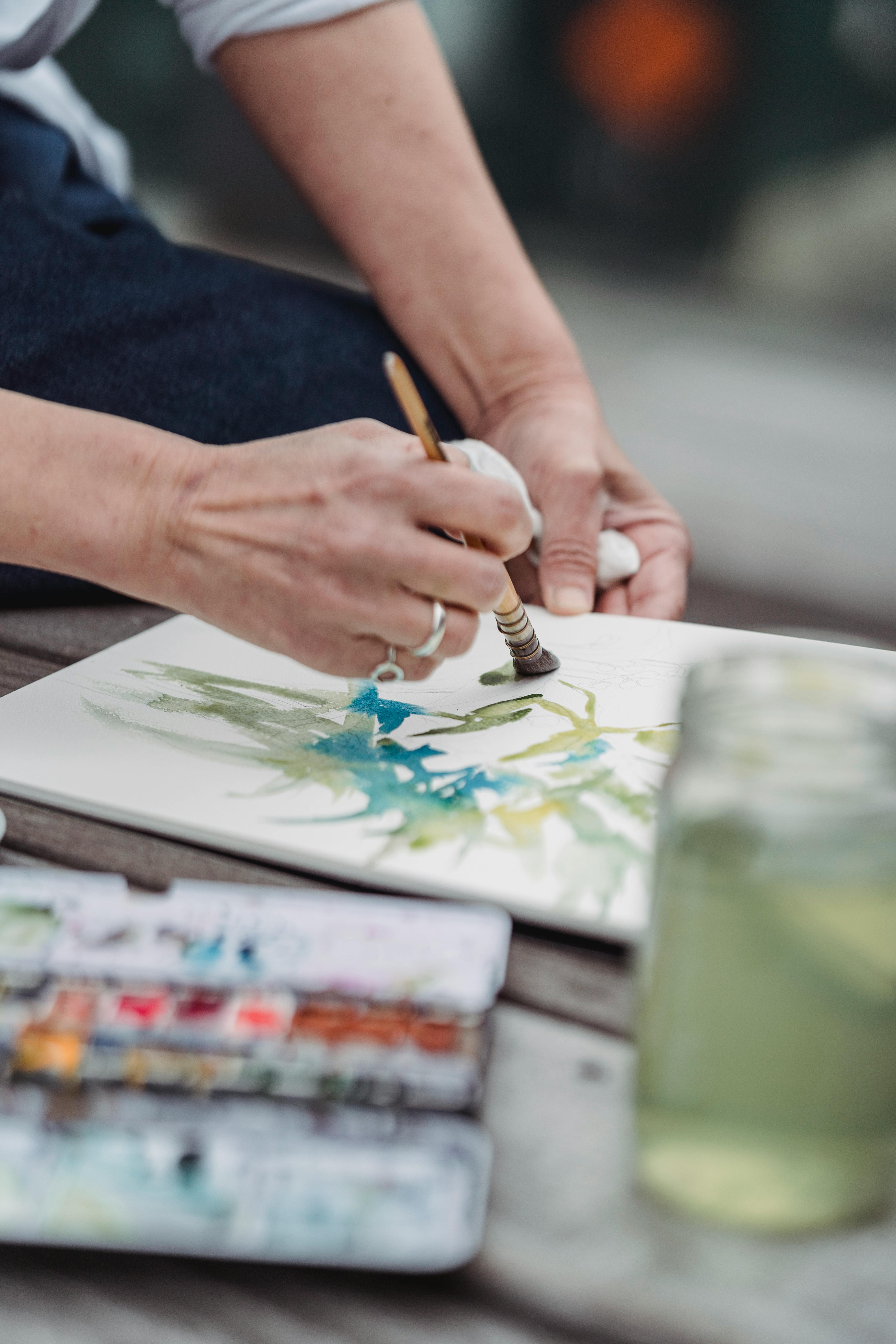 Person Painting an Artwork · Free Stock Photo