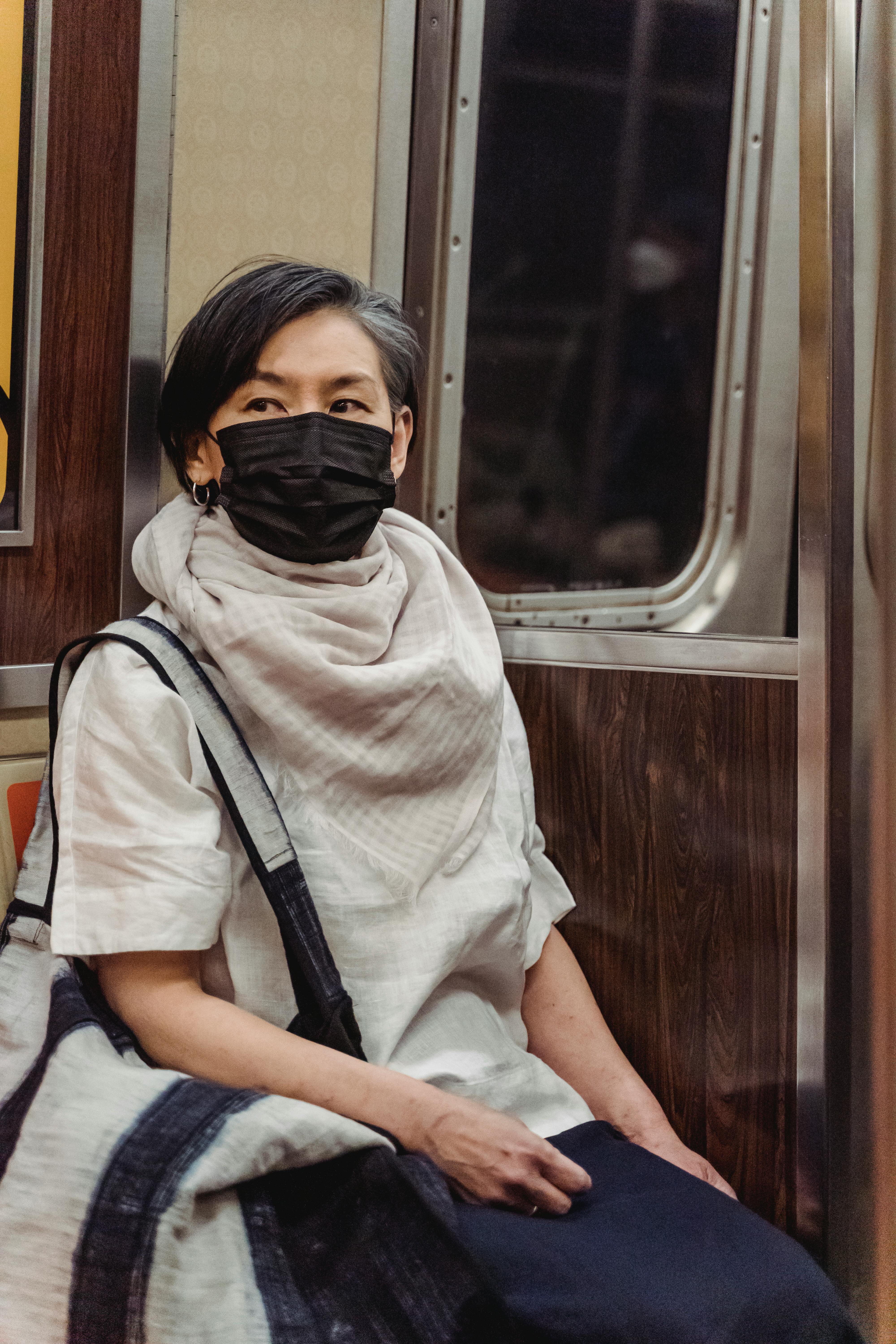 Short-Haired Woman Wearing a Black Face Mask · Free Stock Photo