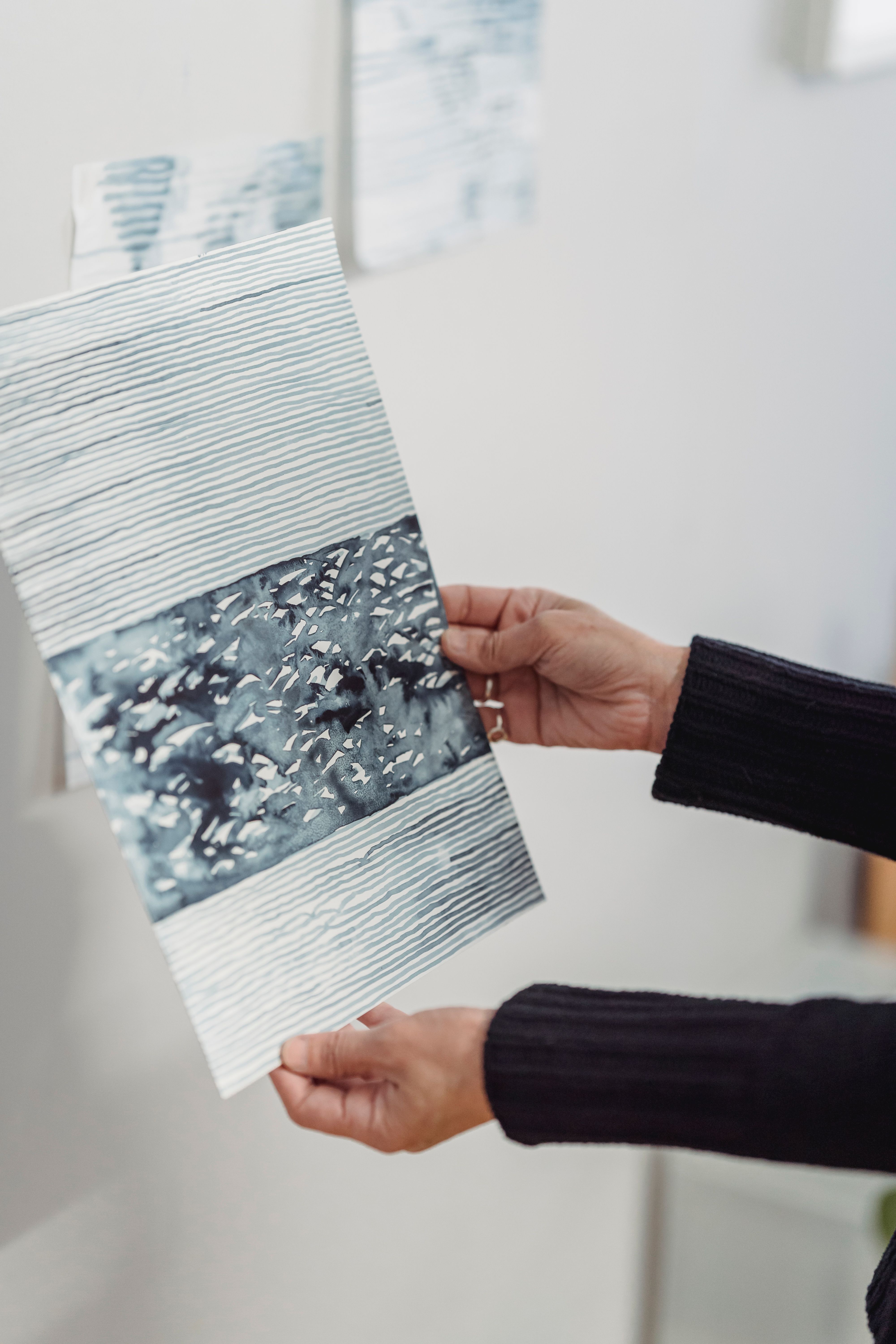 Person Holding an Abstract Painting · Free Stock Photo