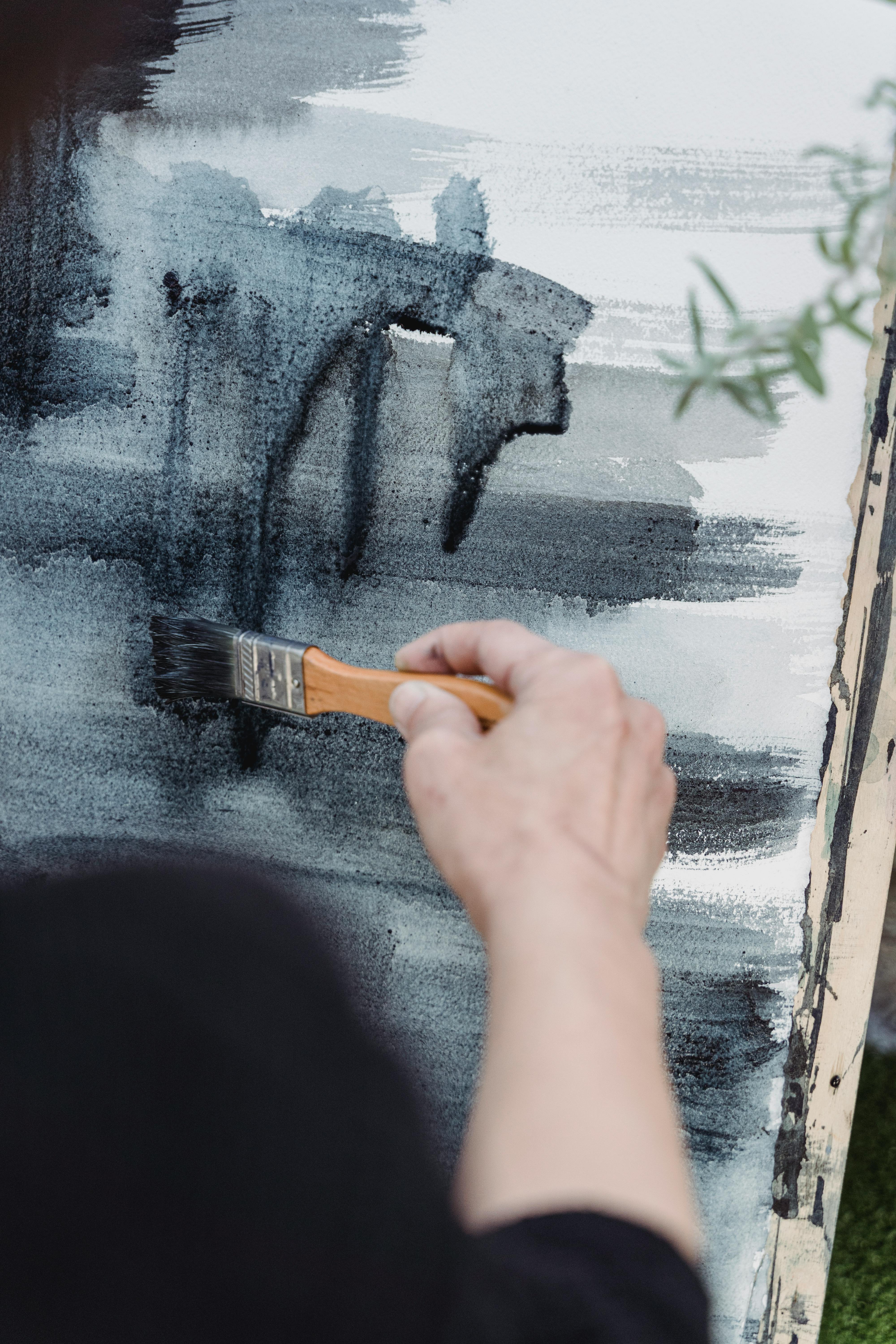 Close-Up Photo of a Person Painting an Artwork · Free Stock Photo