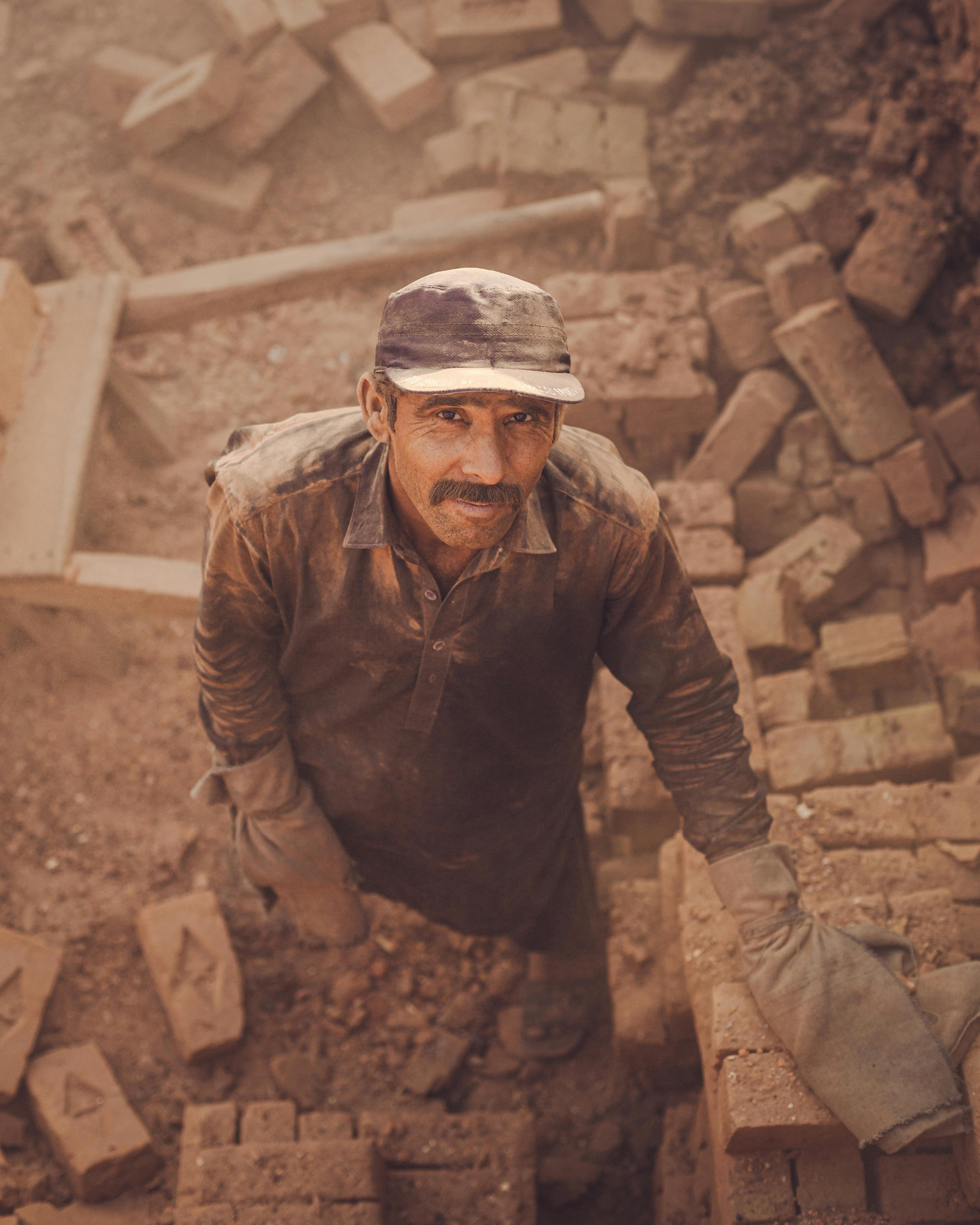 A Shirtless Man Applying Cream on His Face · Free Stock Photo