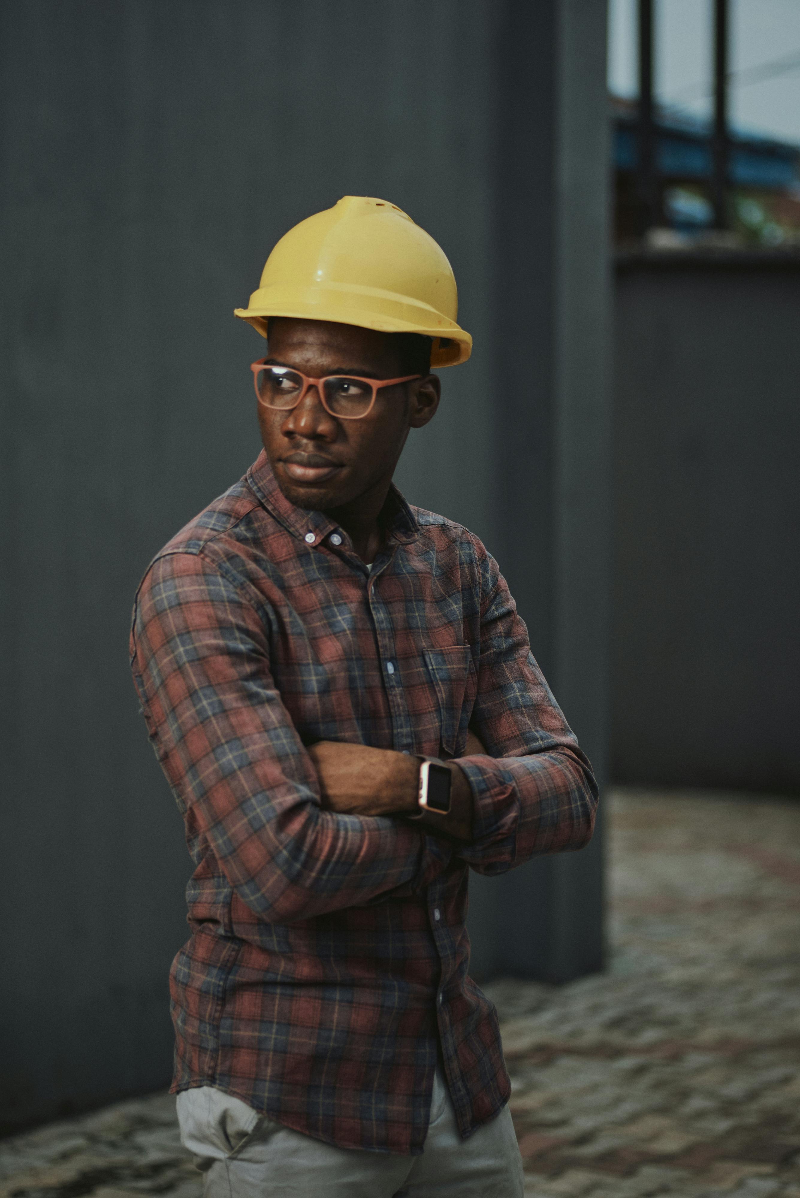 Smiling male worker in construction helmet in studio · Free Stock Photo