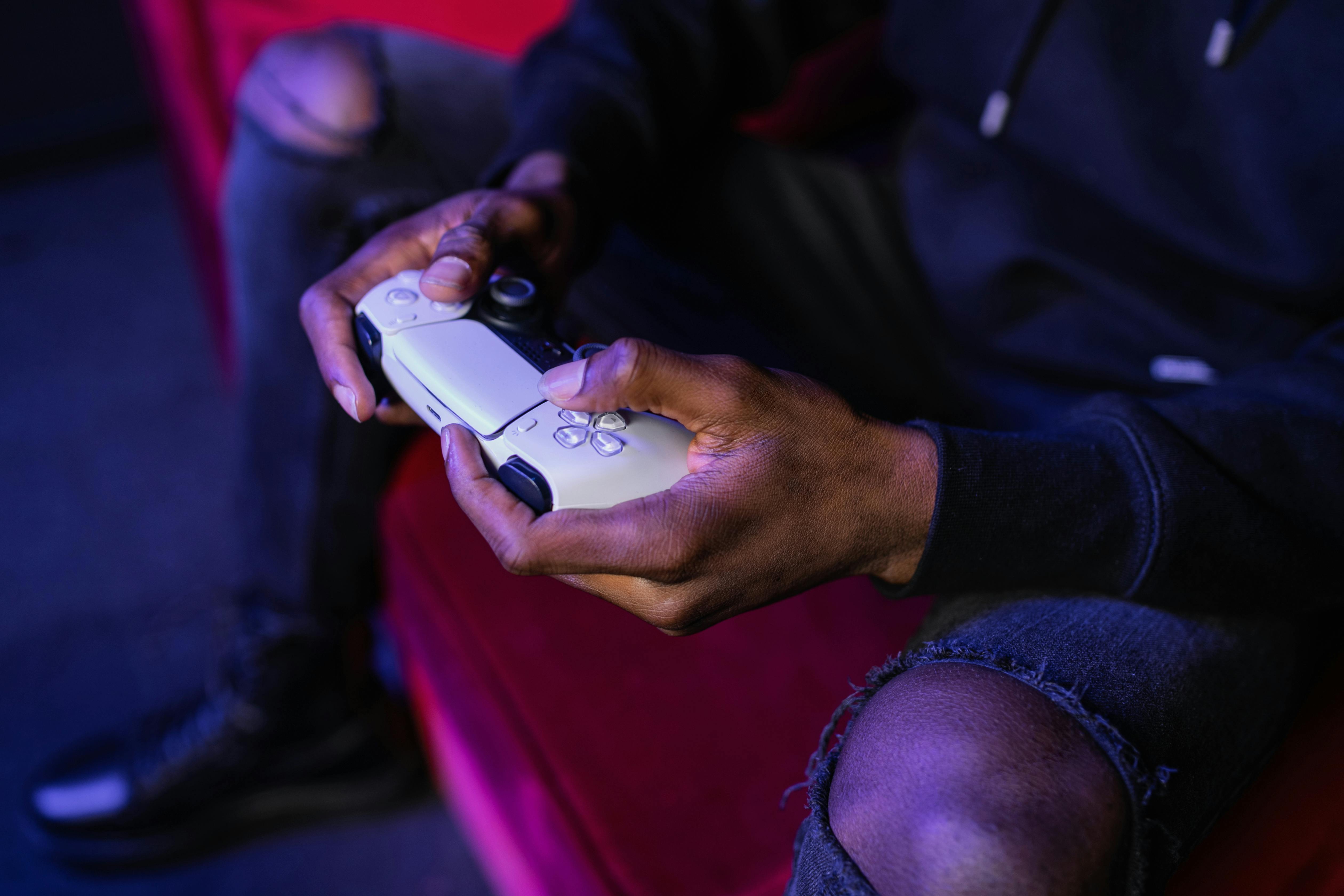 A Person Holding a Game Controller · Free Stock Photo
