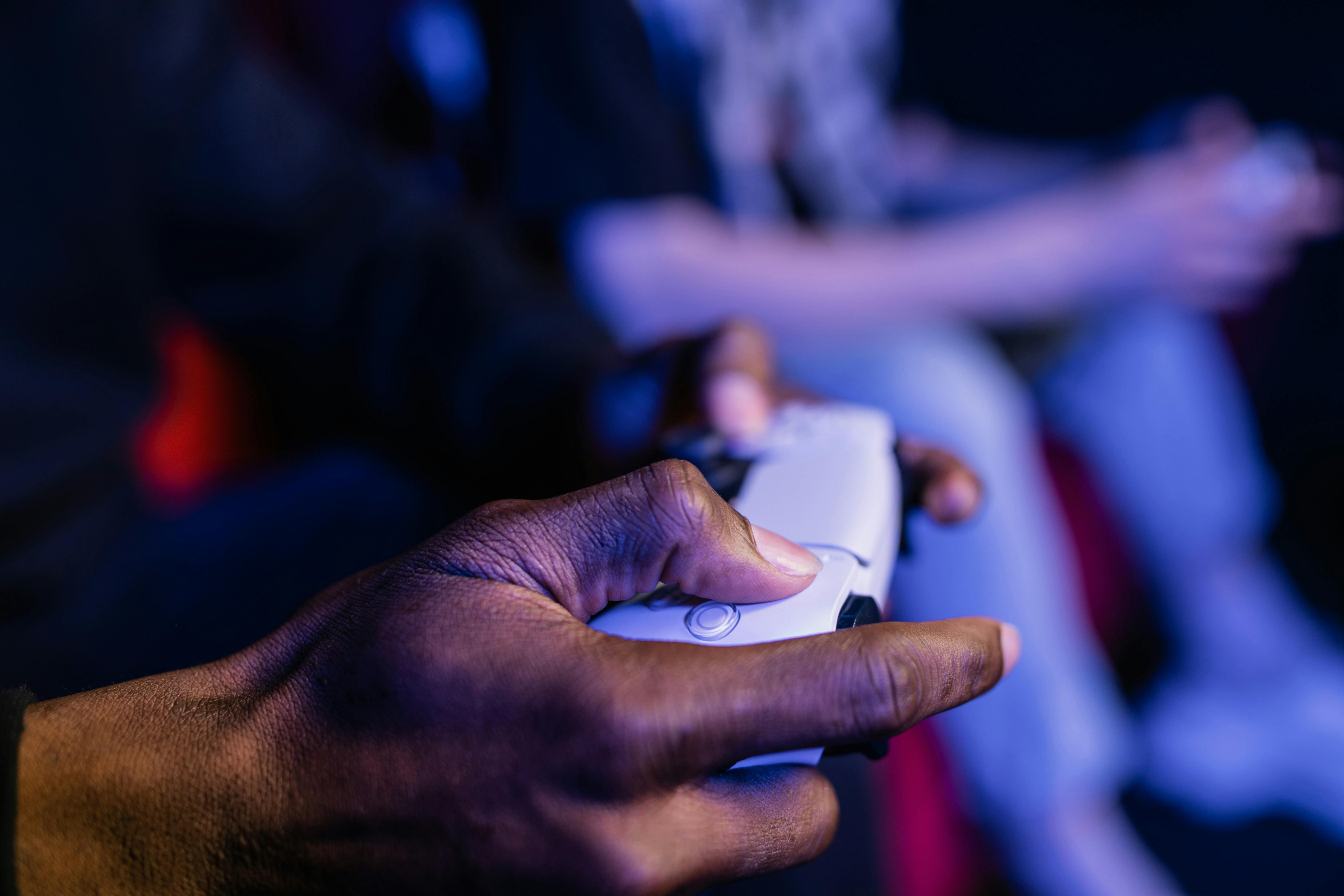 Person Pushing the Buttons on a Game Controller · Free Stock Photo