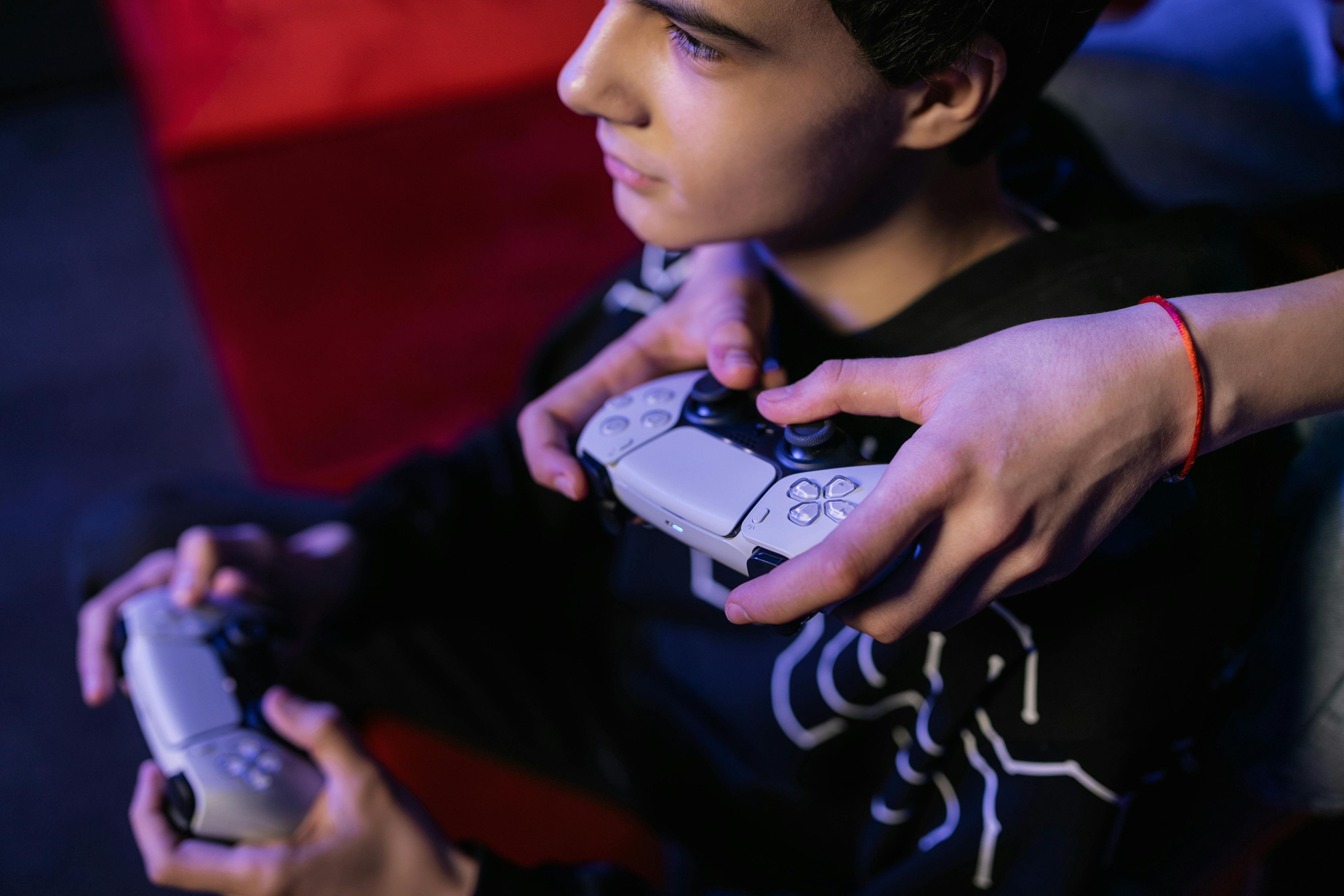 White Gaming Console on Wooden Surface · Free Stock Photo