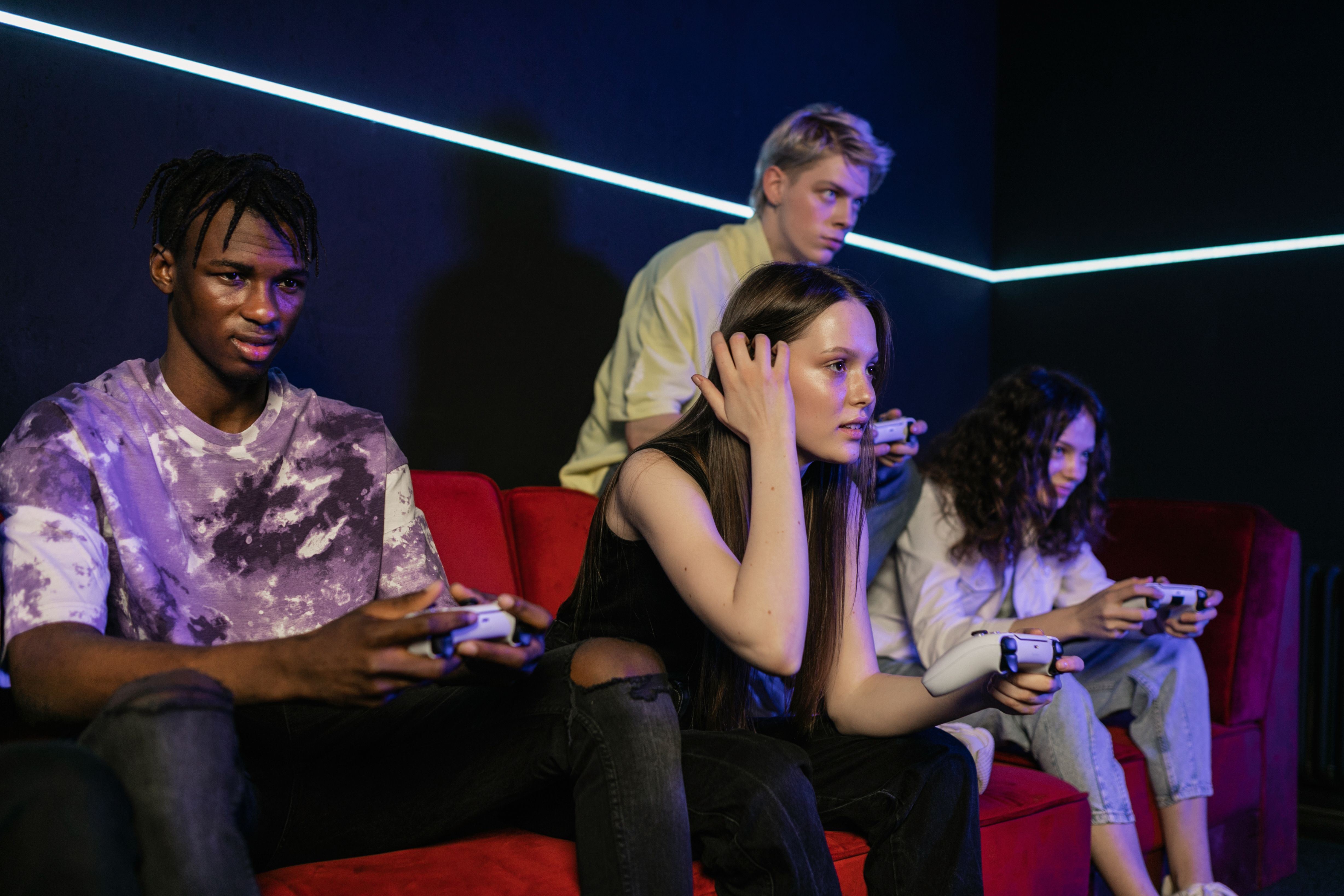 Man and Woman Posing while Holding Game Controllers · Free Stock Photo