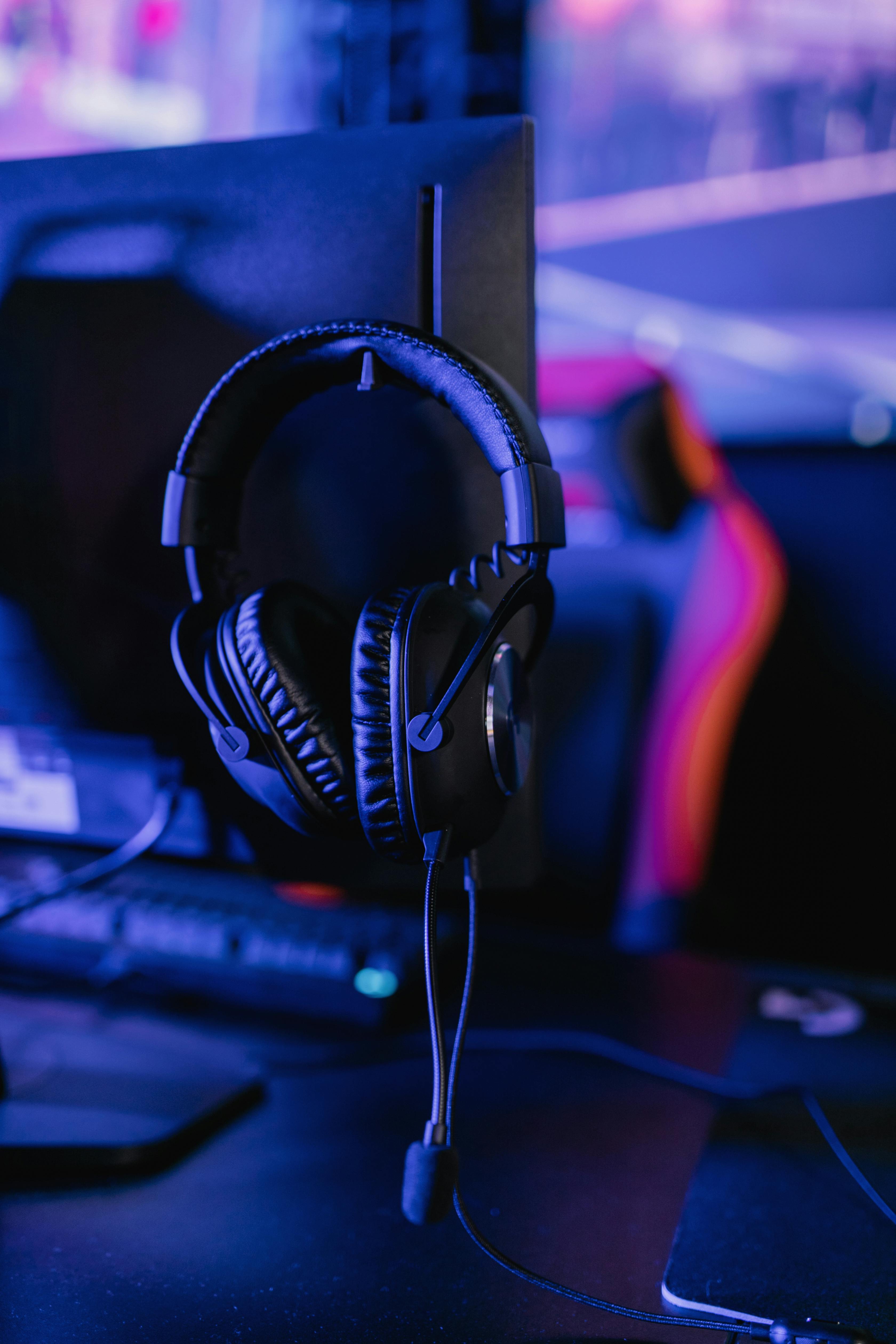 Black Wireless Headphones On White Table · Free Stock Photo