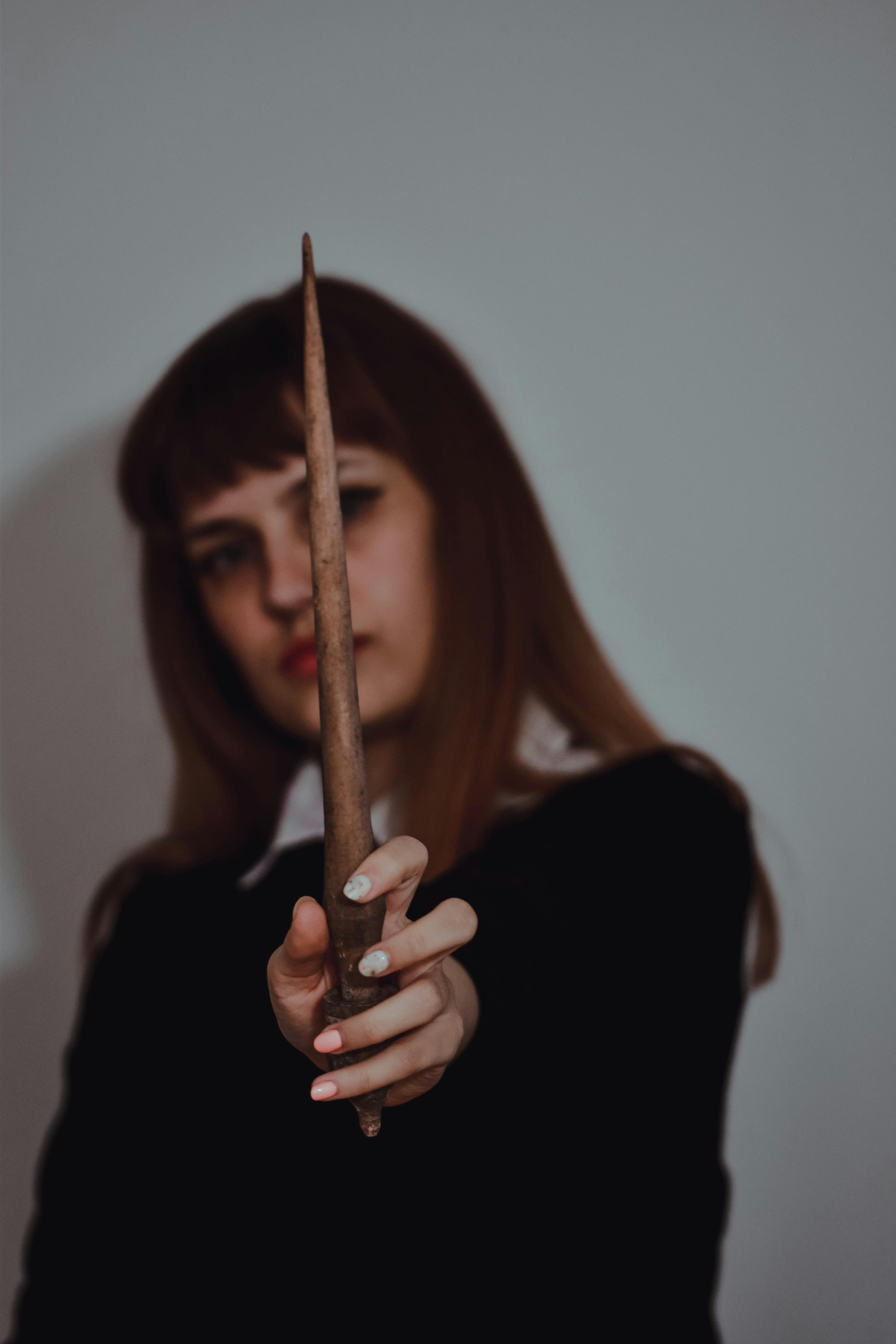 Woman Holding a Pointed Object · Free Stock Photo