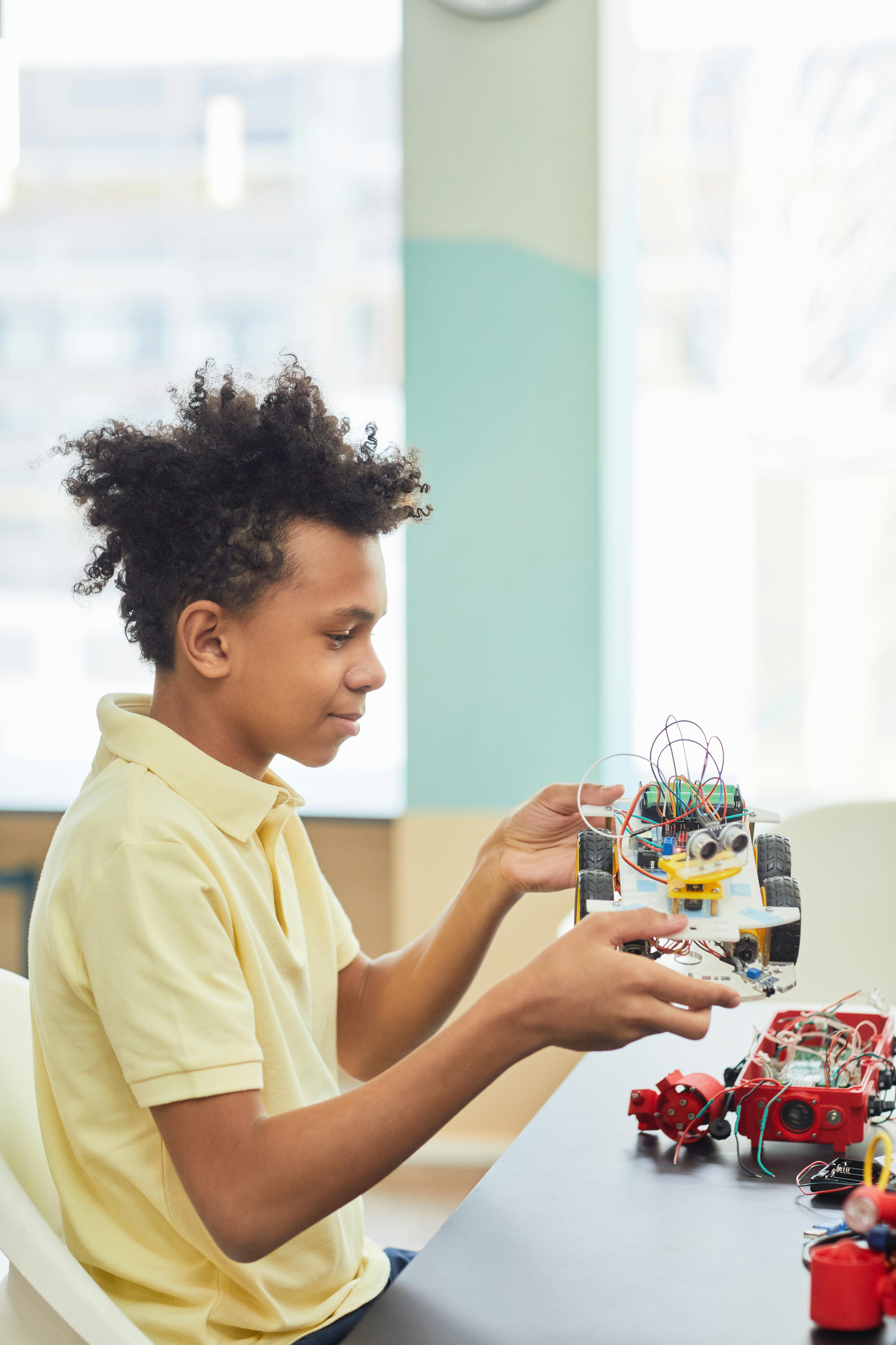 A Boy Sitting at the Table · Free Stock Photo