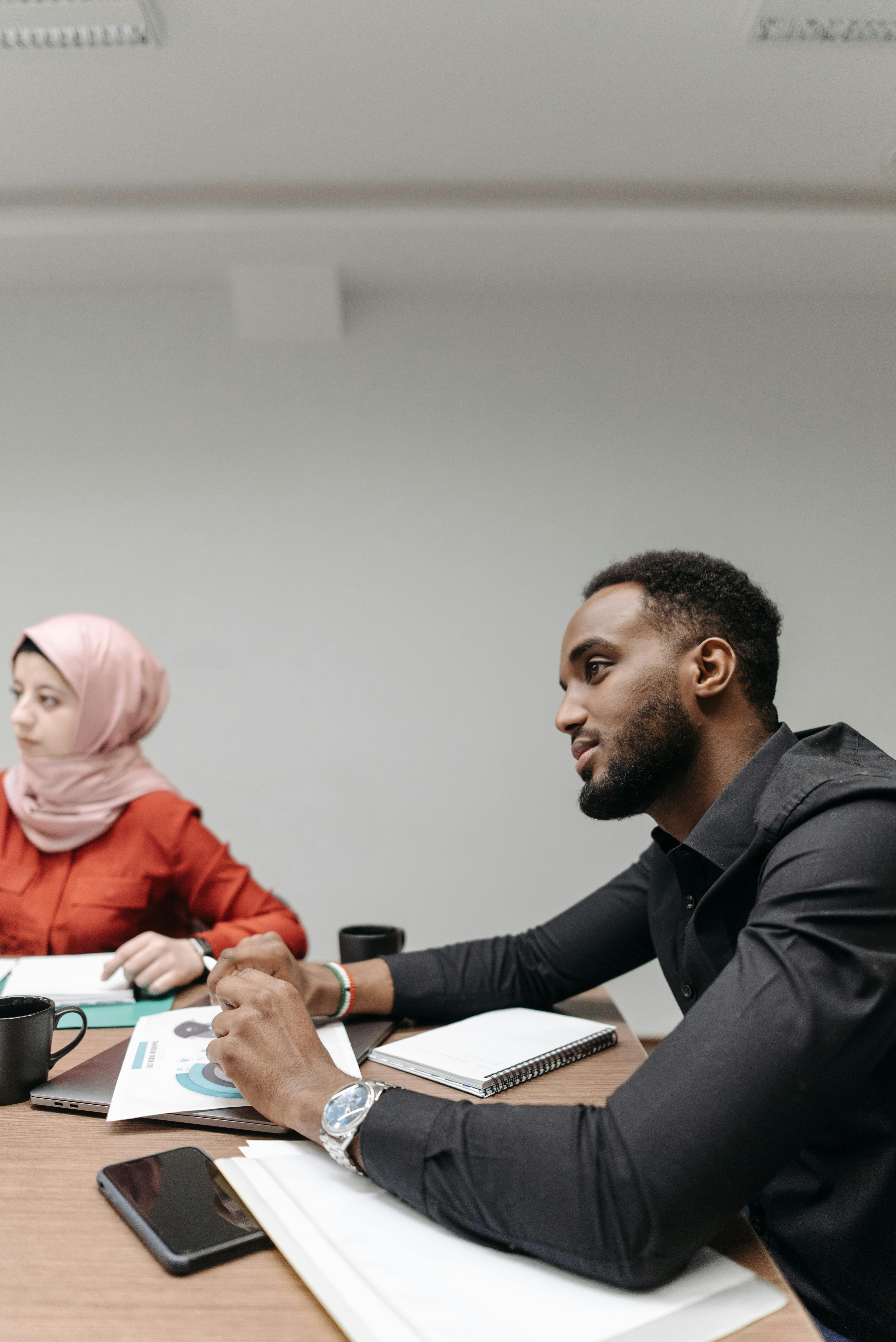 A Man Sitting at the Table · Free Stock Photo