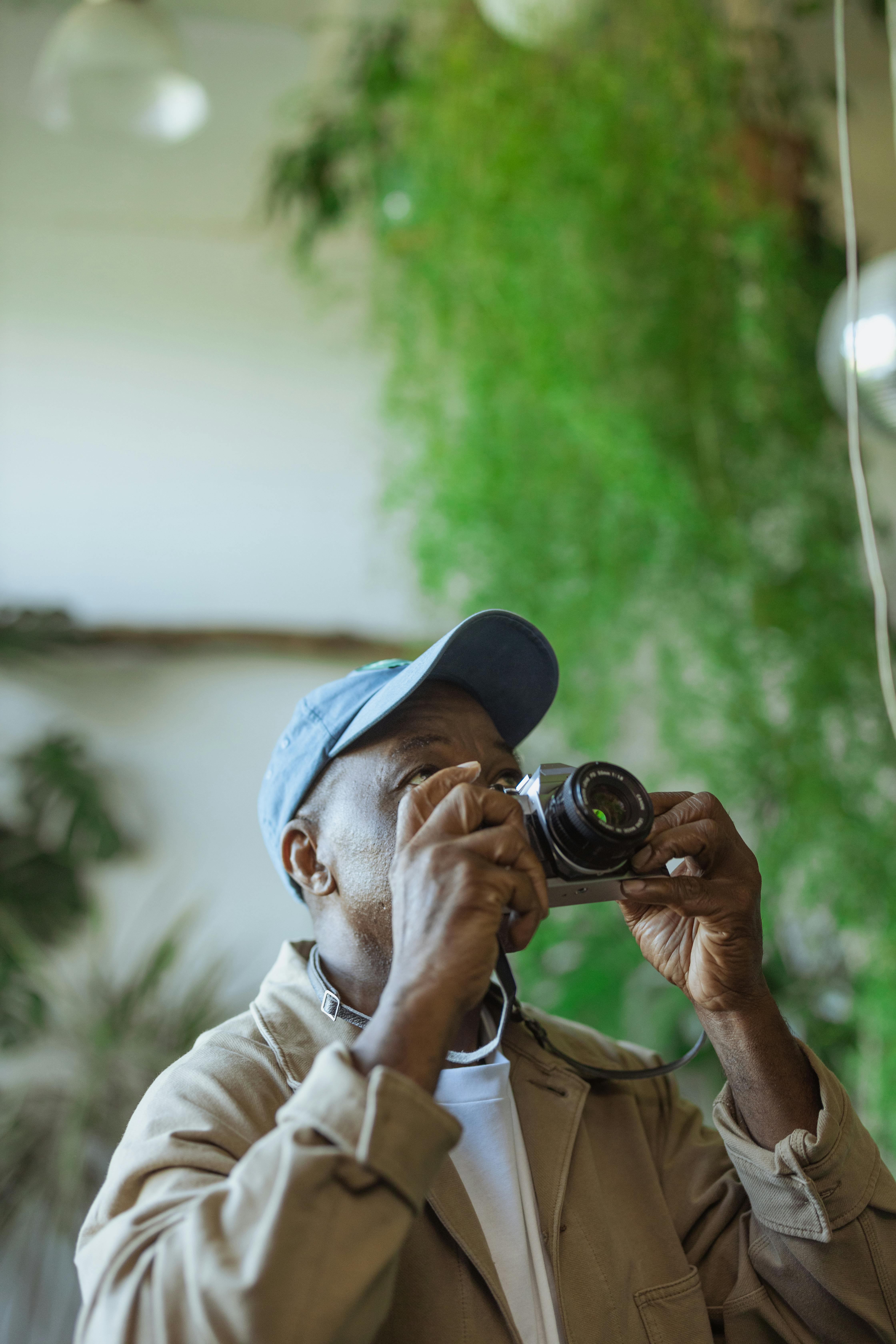 Photo of Man Holding Vintage Camera · Free Stock Photo