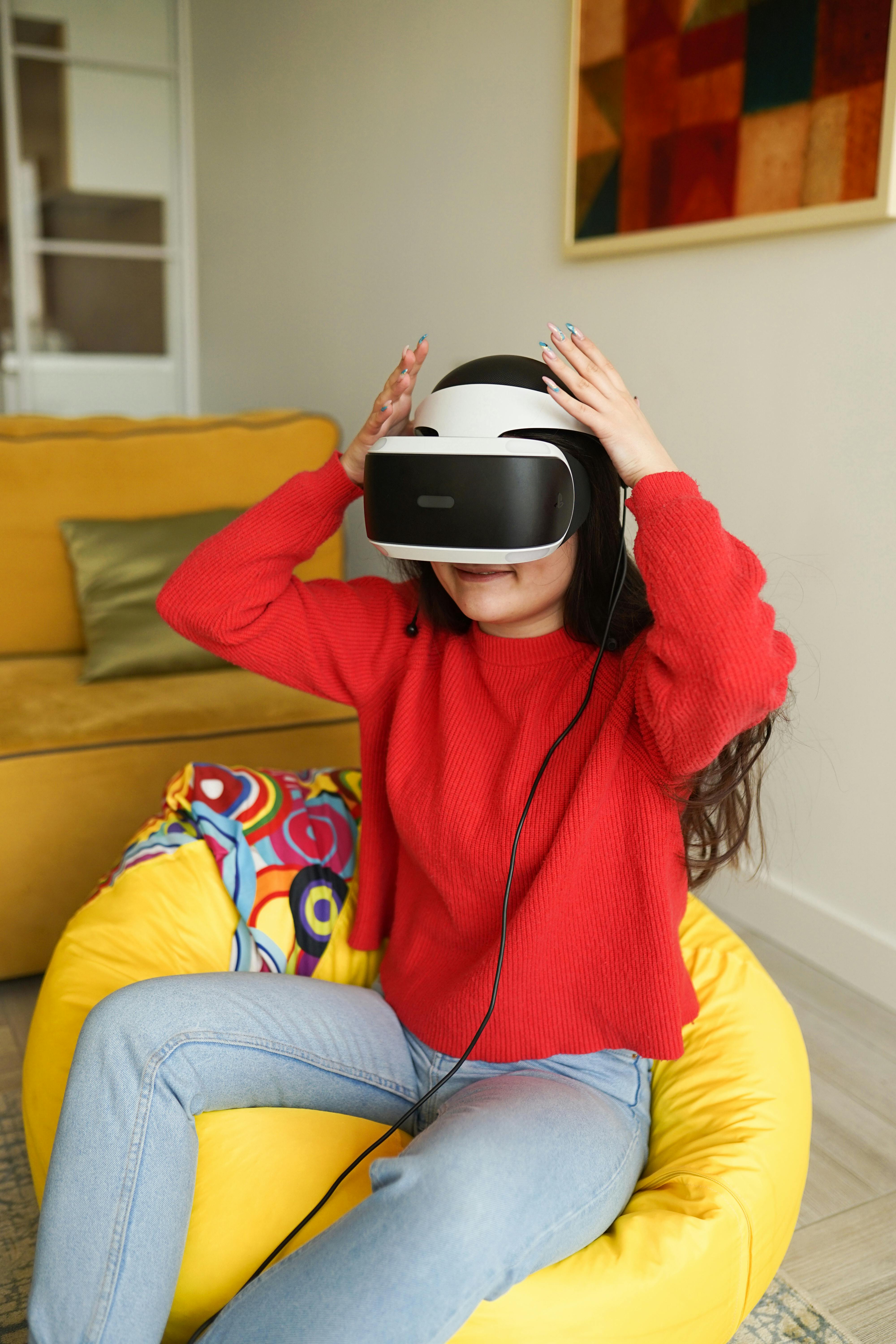 A Woman in a Tank Top Using a VR Headset · Free Stock Photo