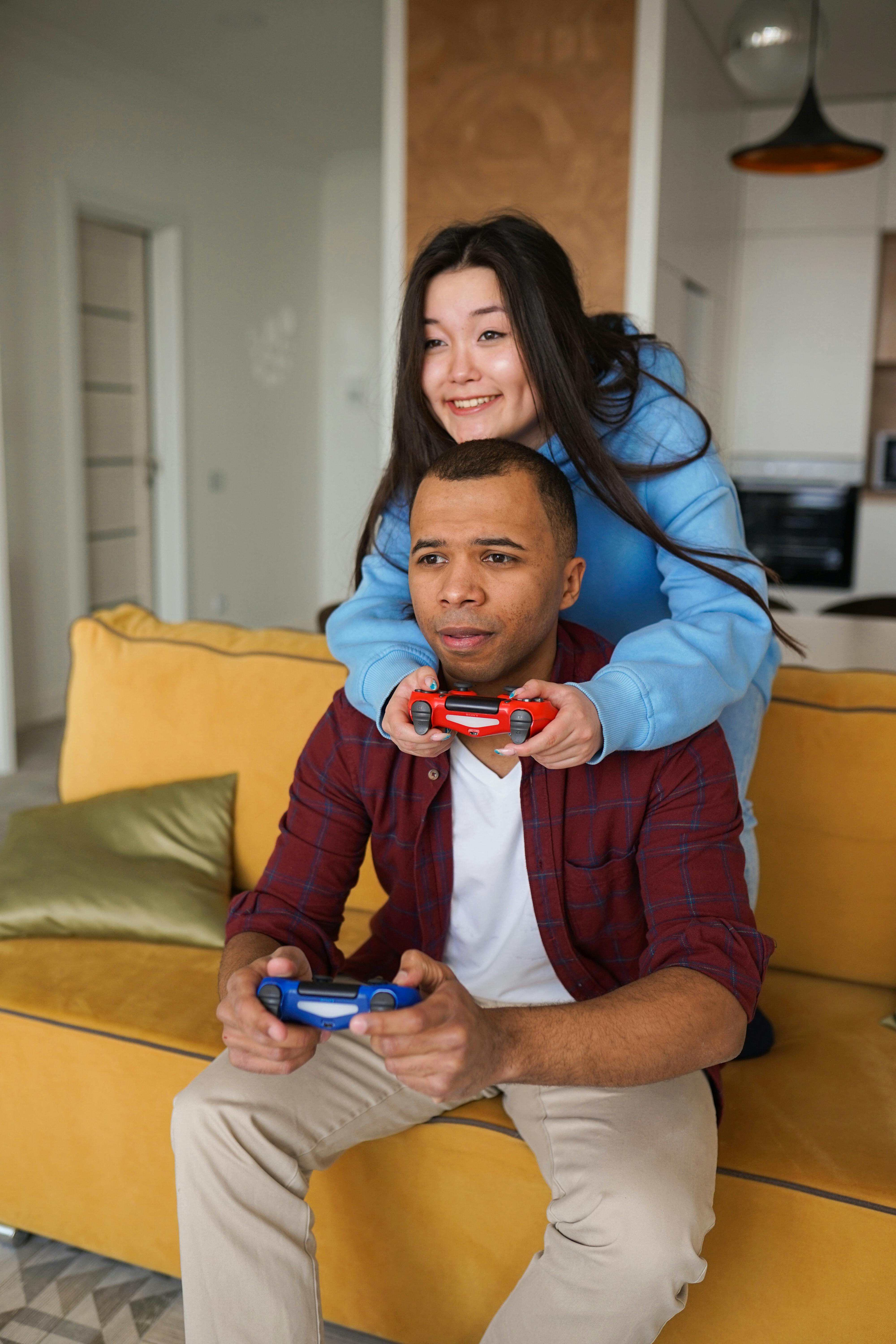 Woman and Man Holding Gaming Remote Controllers · Free Stock Photo