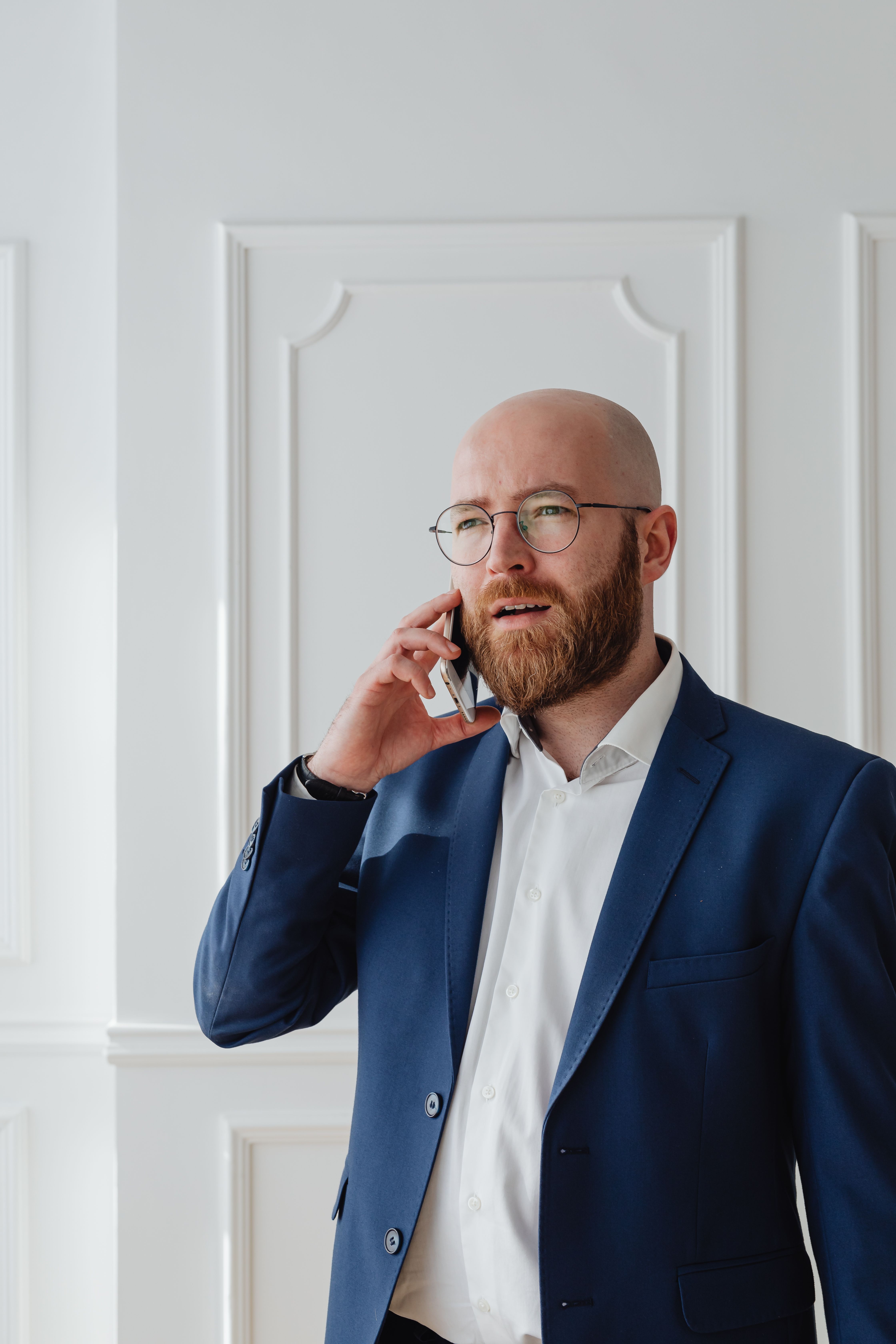 Bald Man Talking to Someone Through Smartphone · Free Stock Photo