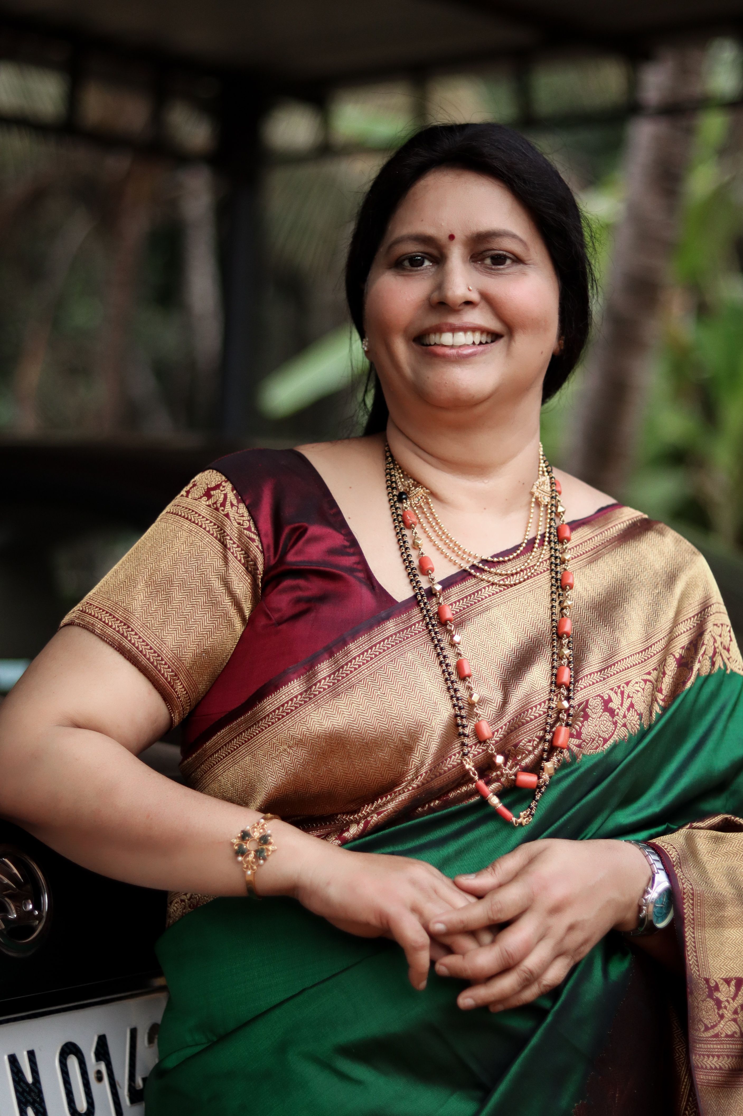 Unwrapped Sari Flying behind Woman Standing on Bridge · Free Stock Photo