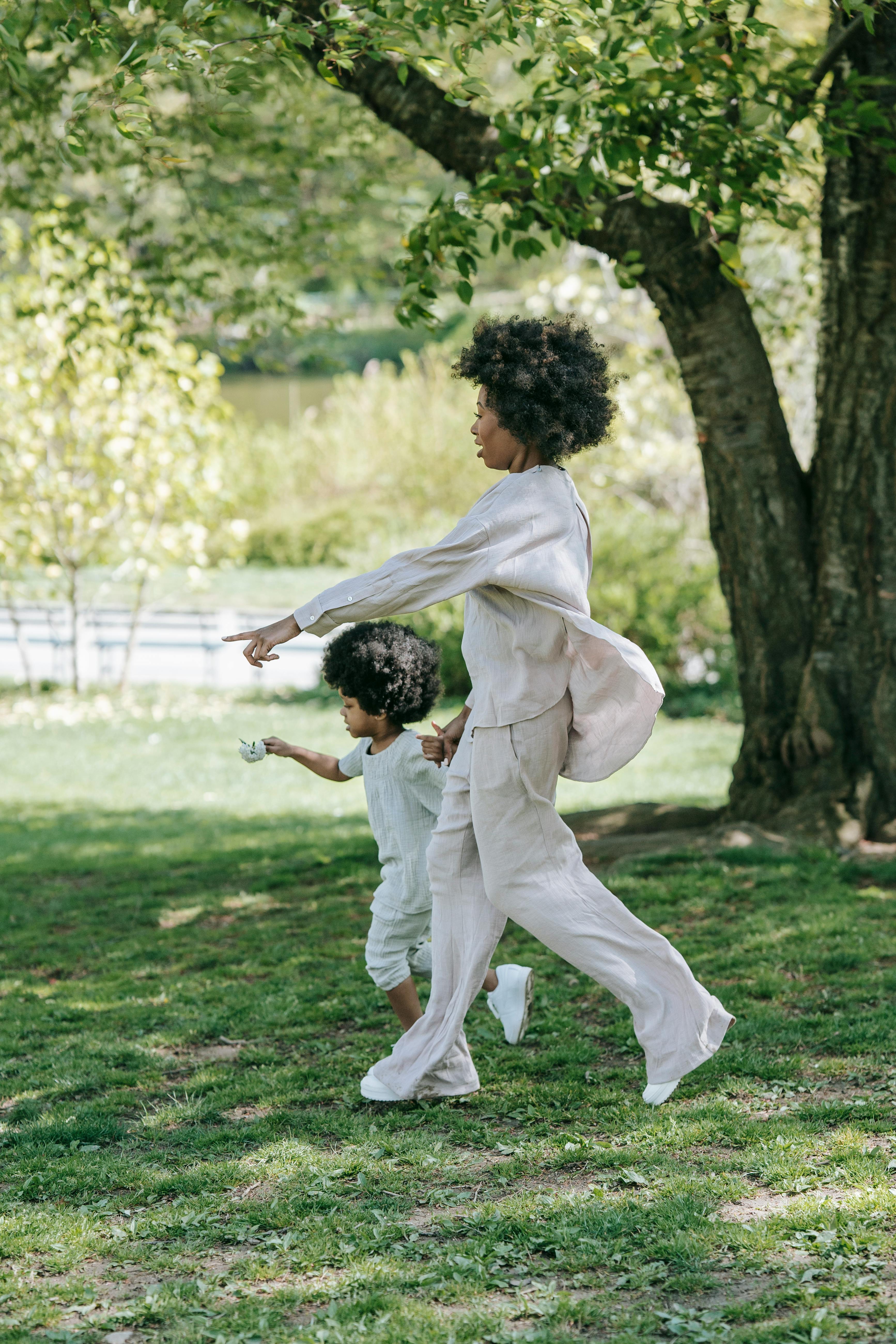 A Woman Chasing Her Child in a Park · Free Stock Photo