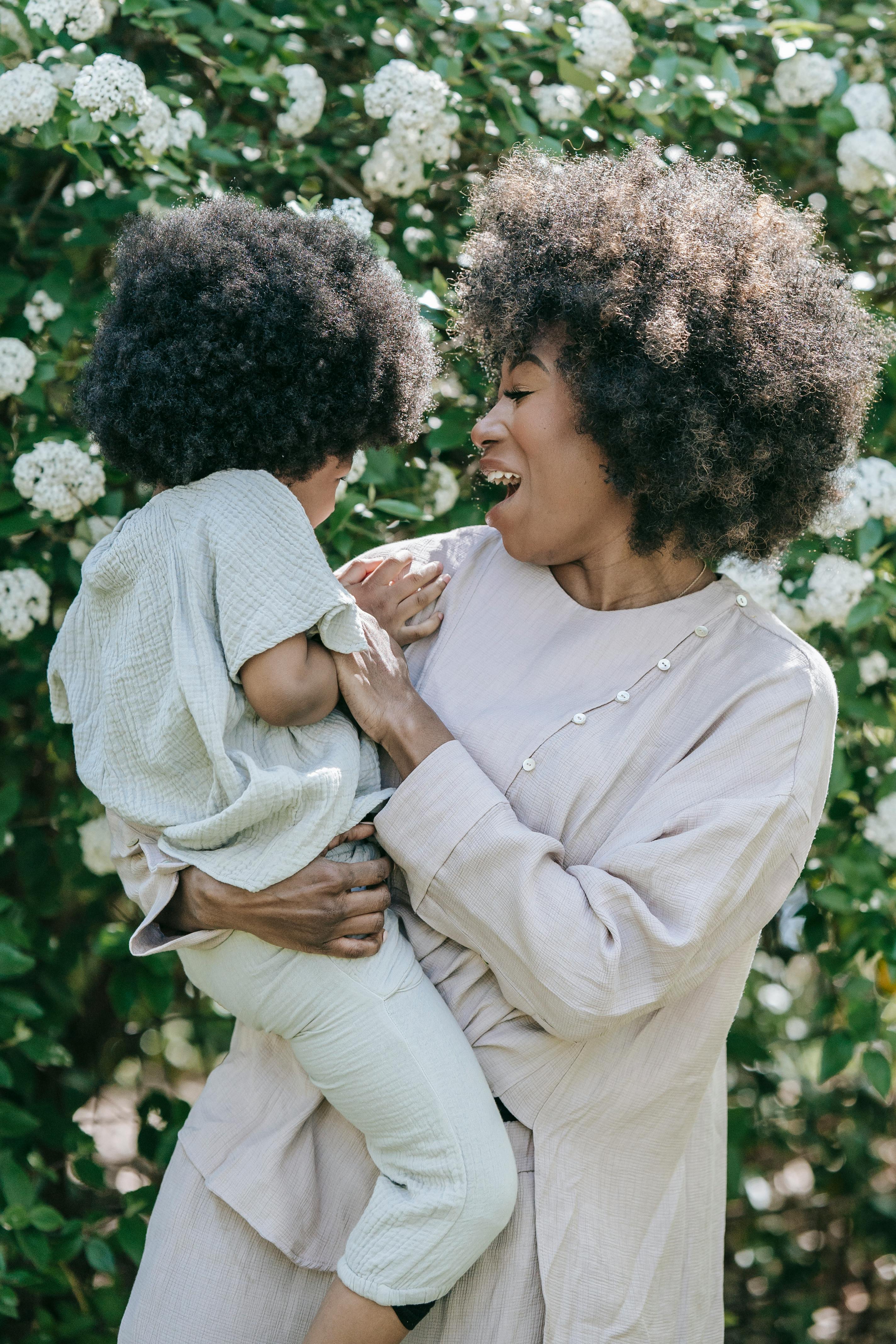 A Woman Chasing Her Child in a Park · Free Stock Photo
