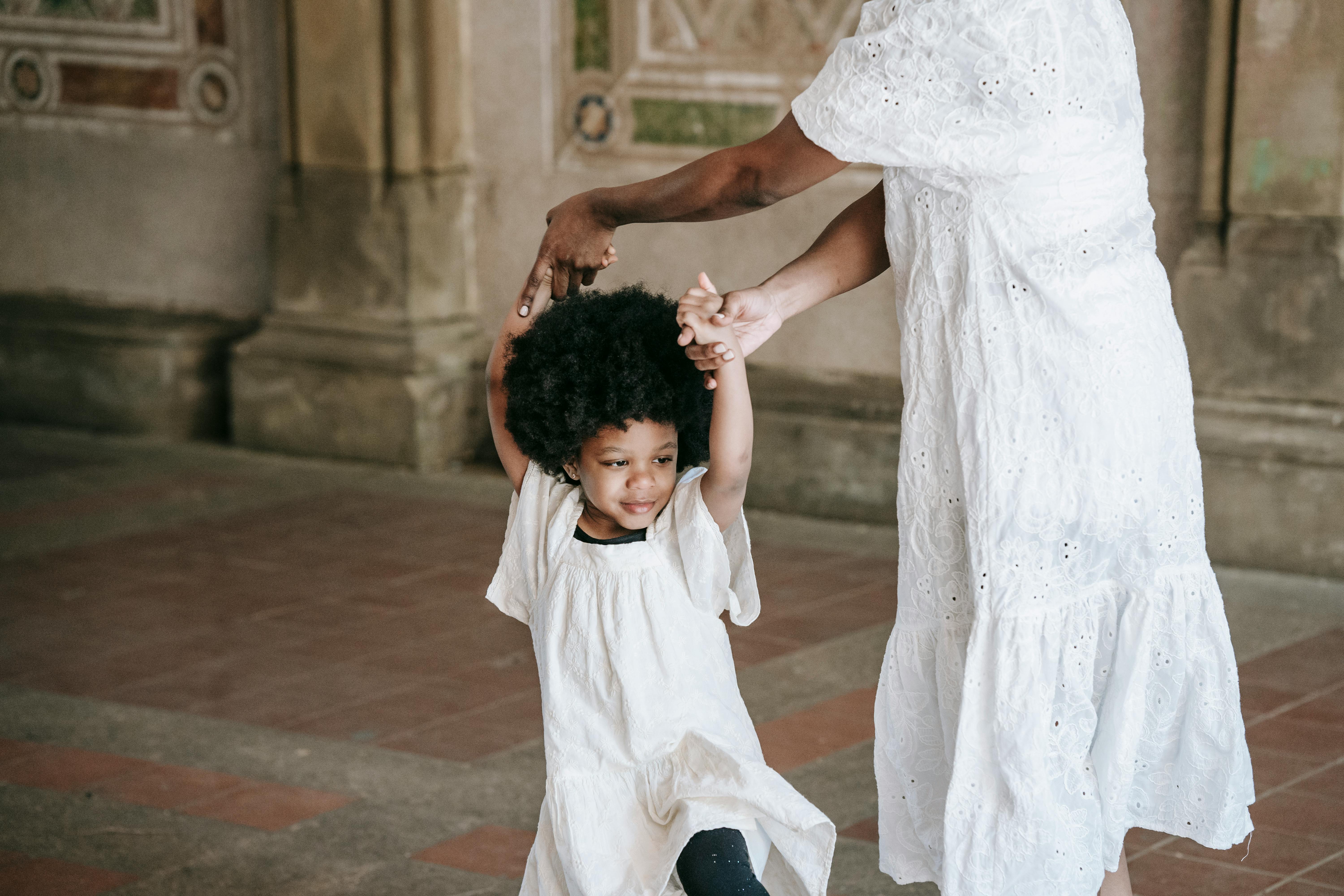 Girl with her Arms Raised · Free Stock Photo