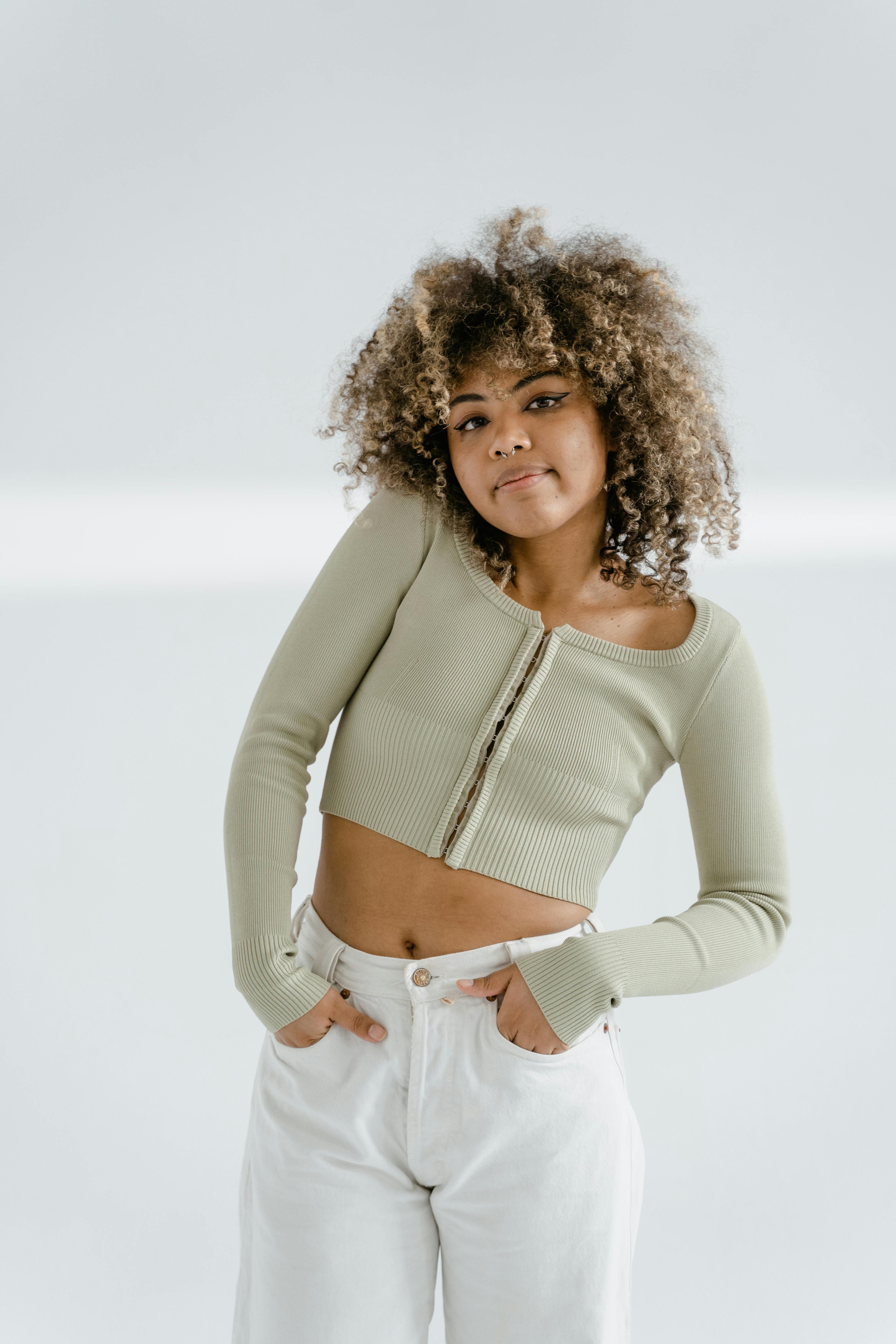 A Woman in Gray Crop Top with Hands in Pocket · Free Stock Photo