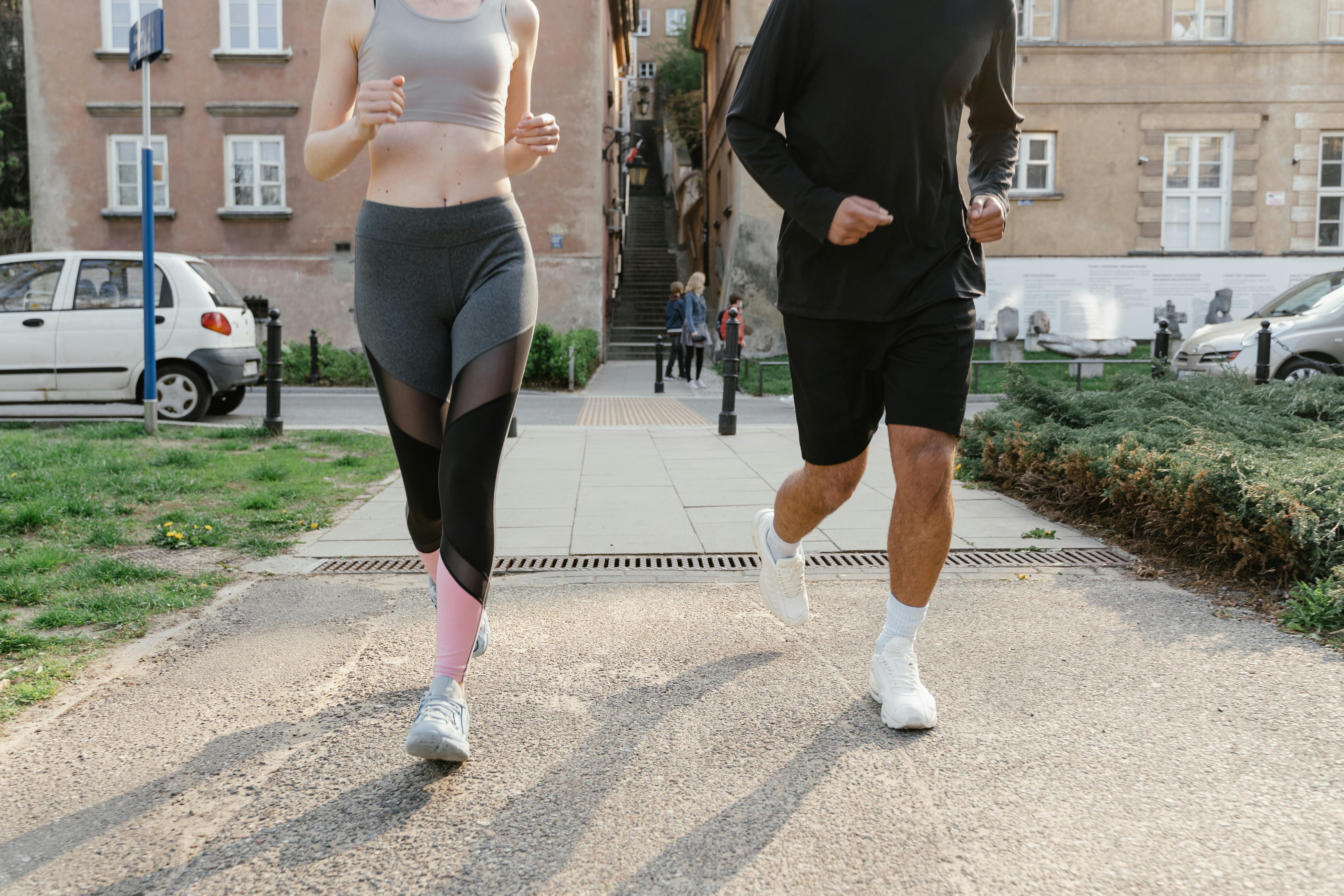Man and Woman Running Together · Free Stock Photo