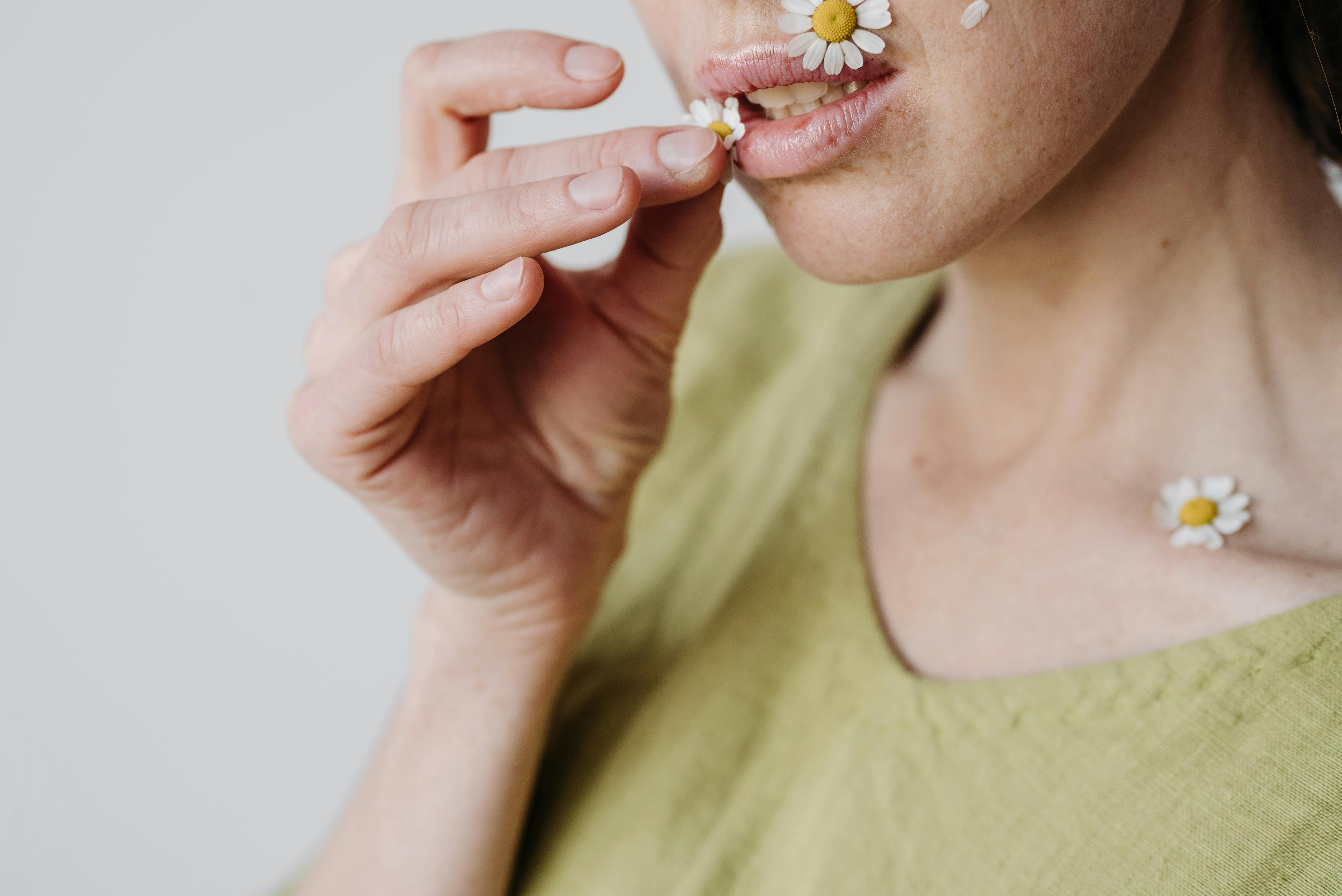 Close up of Woman with Daisy Petals around Mouth · Free Stock Photo