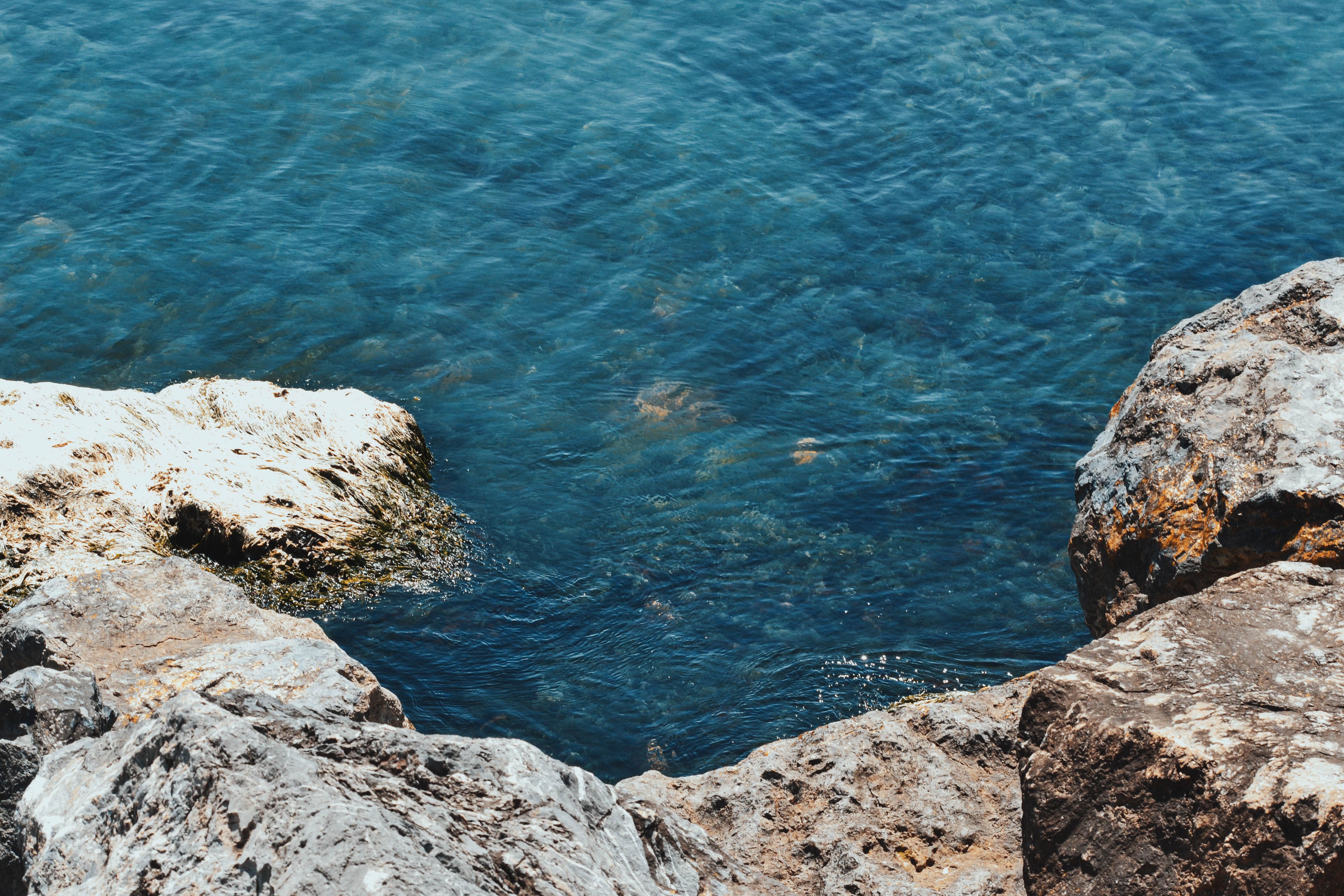 Sea Water between Rock Formations · Free Stock Photo