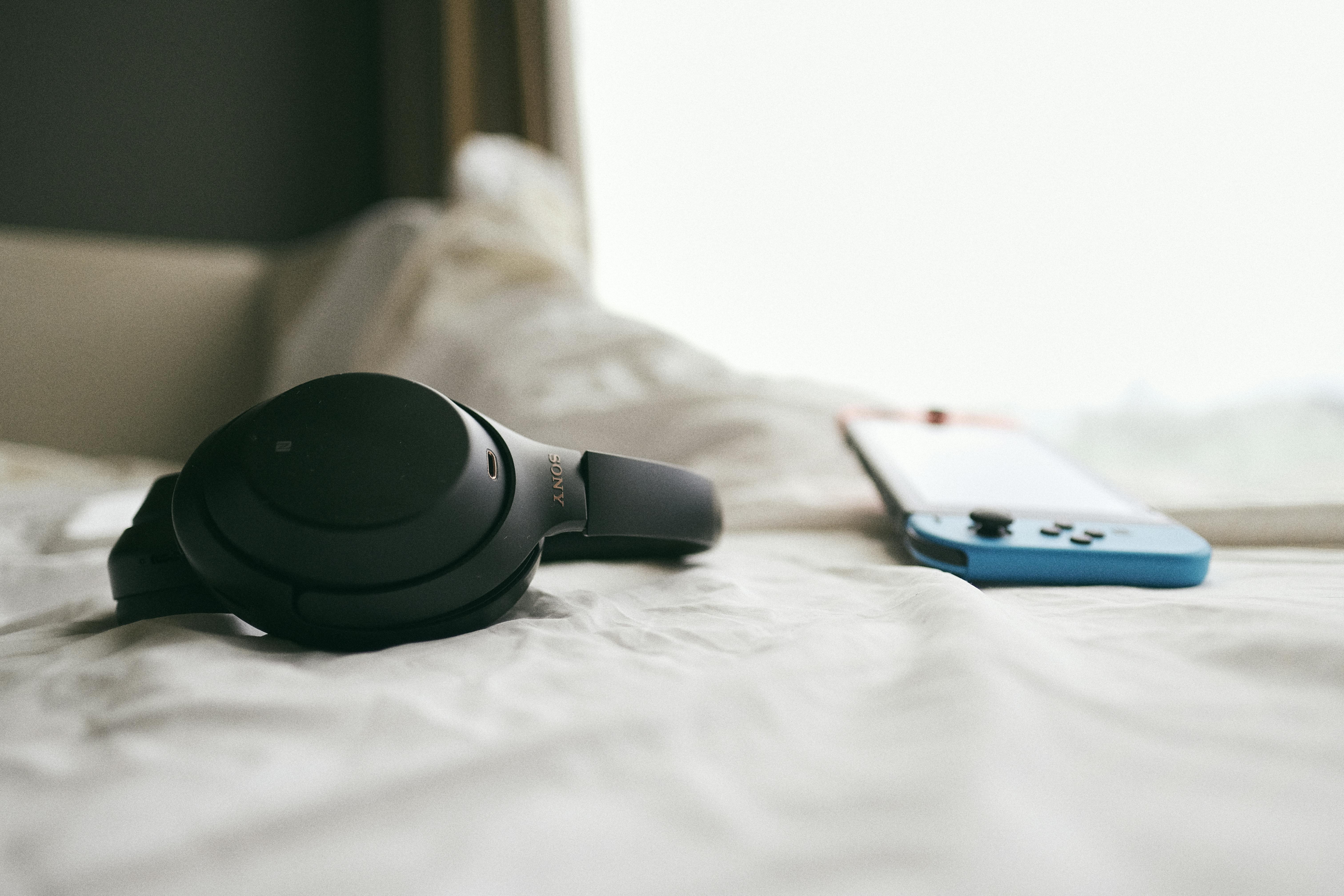Woman Sitting on Floor while Playing Nintendo Switch · Free Stock Photo