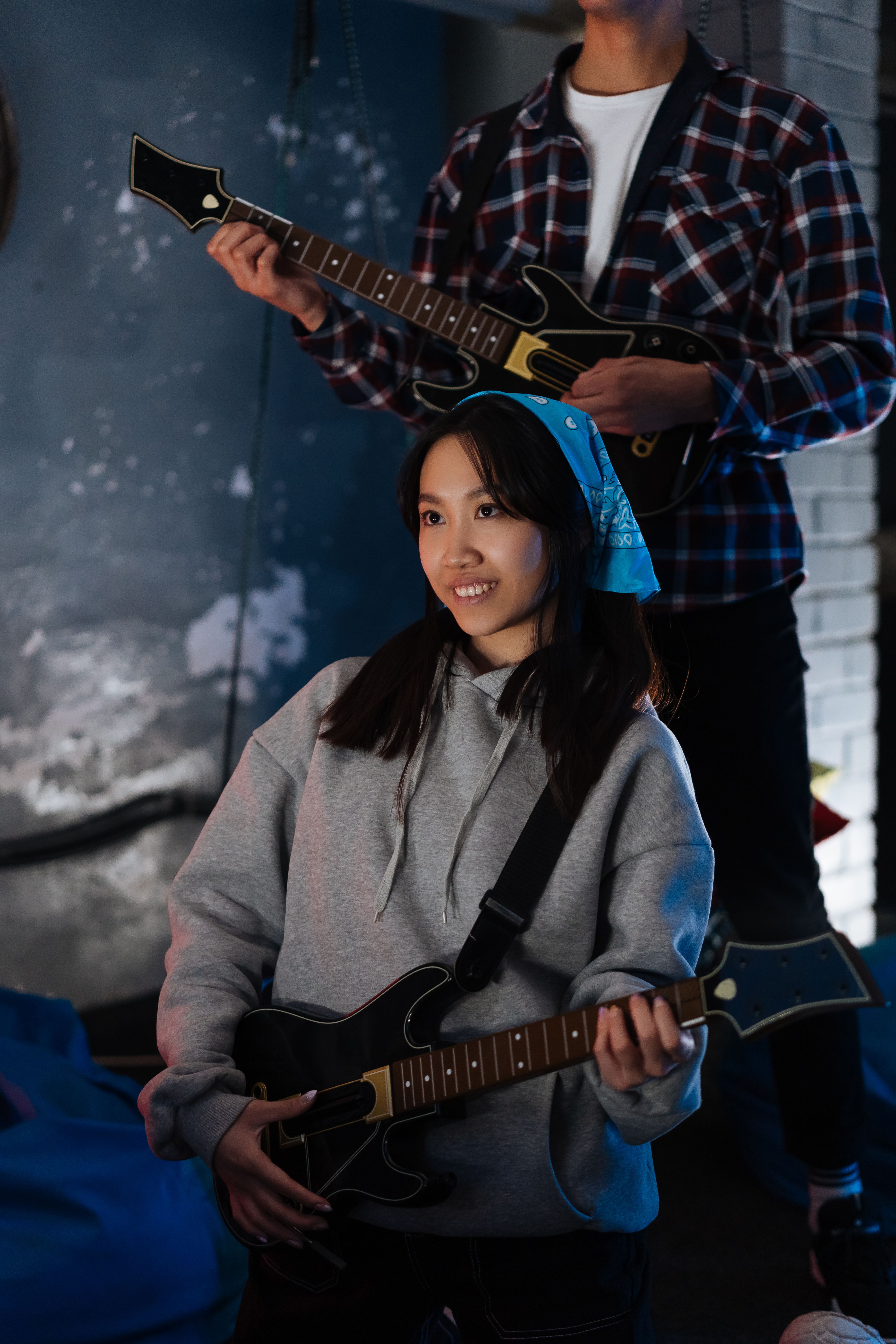 Girl in Gray Hoodie Playing a Guitar · Free Stock Photo