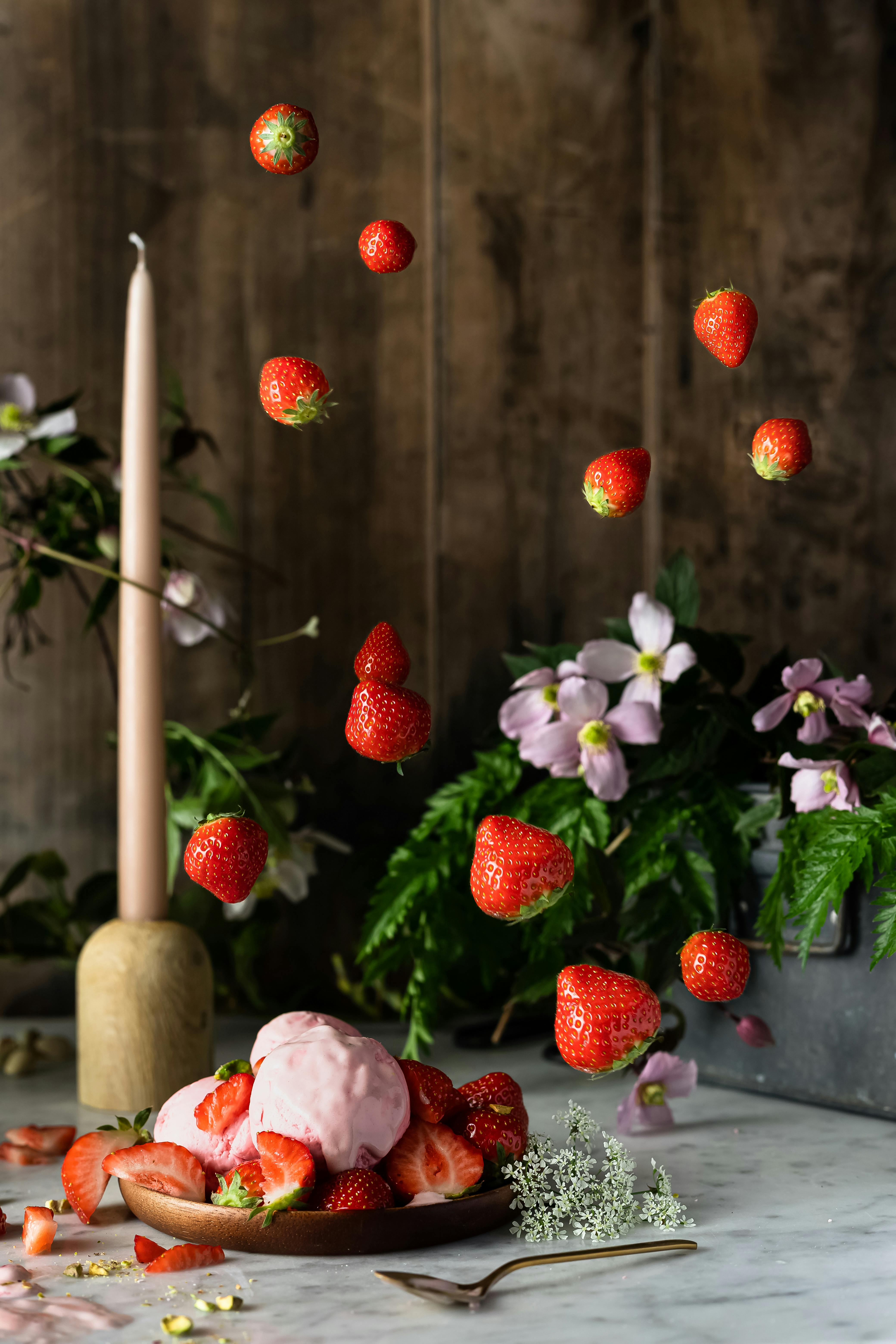 Strawberries Falling Down on a Table · Free Stock Photo
