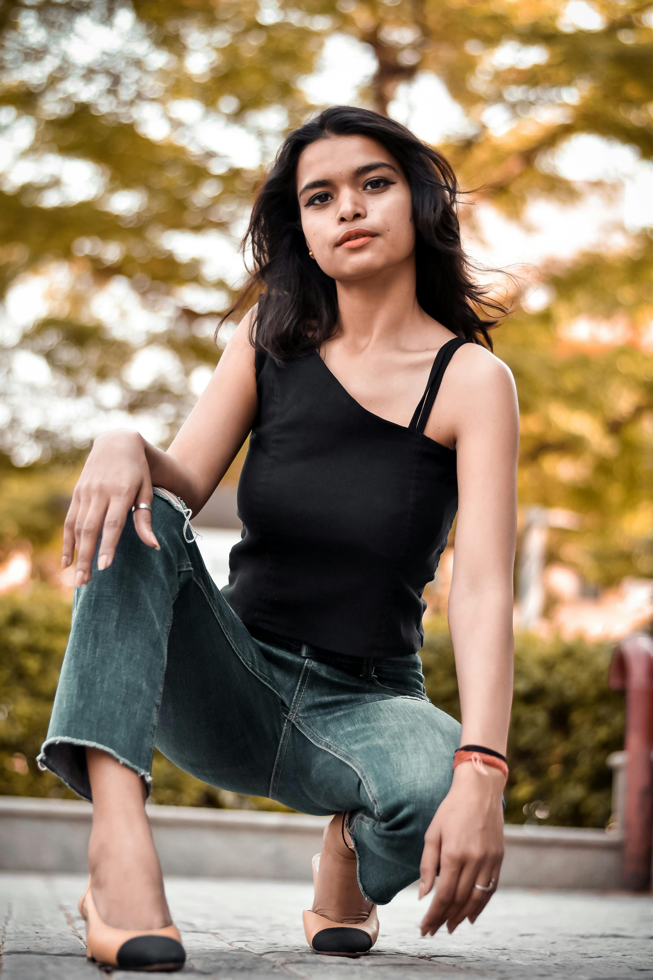 Portrait of a Woman Crouching · Free Stock Photo