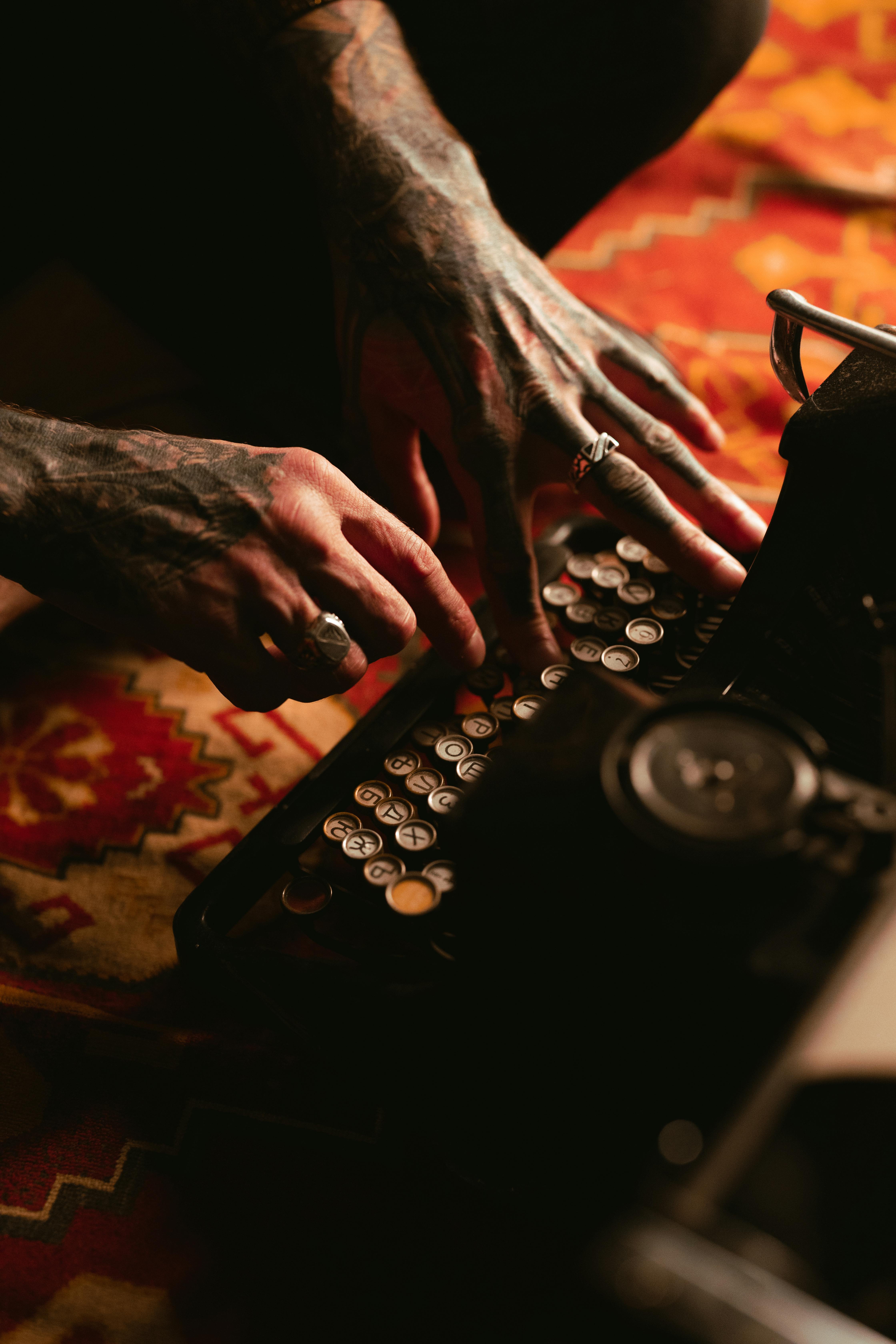 Close-Up Photo of Person Using Typewriter · Free Stock Photo