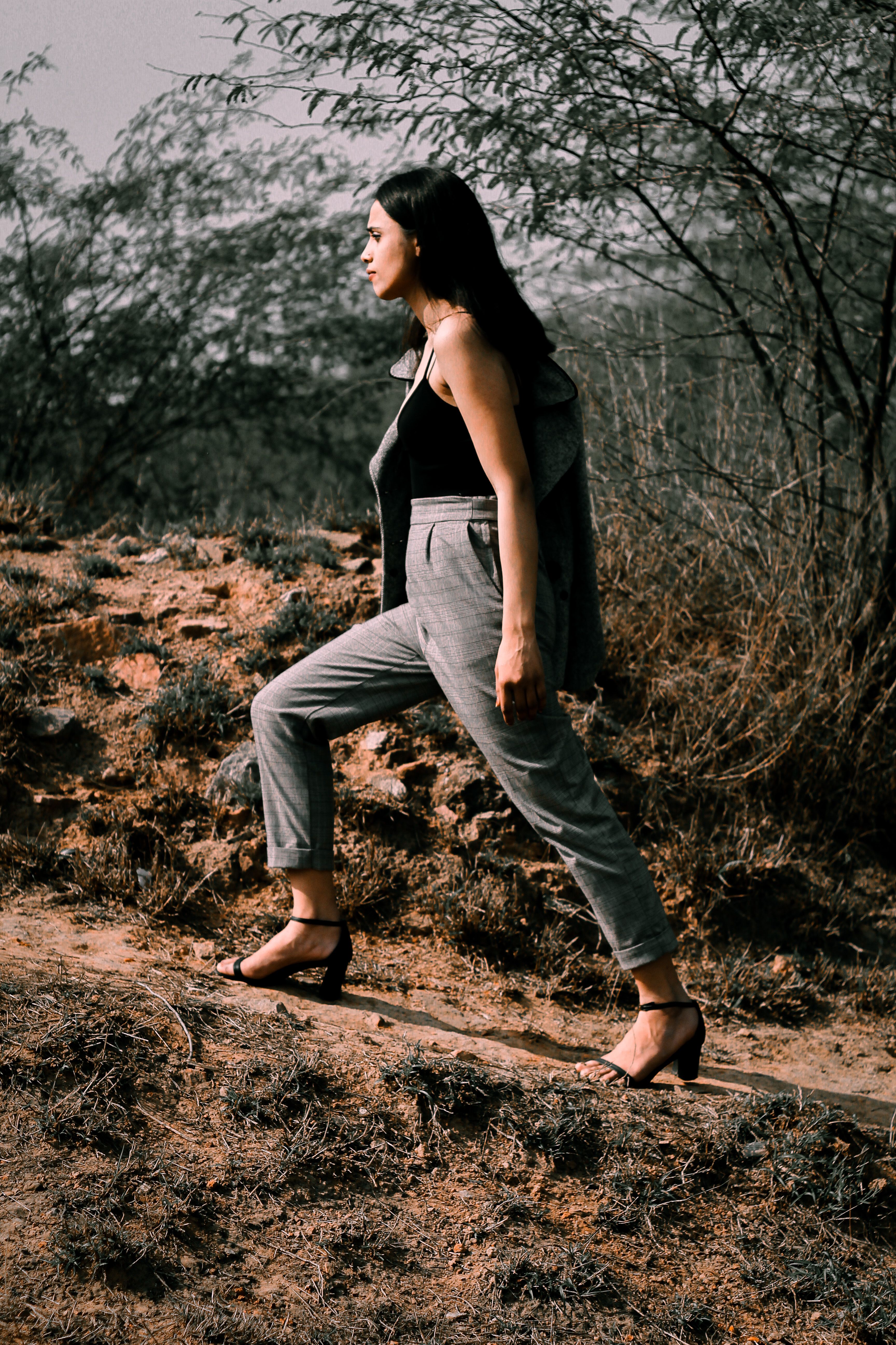 Woman in Formal Wear Walking on a Pathway · Free Stock Photo