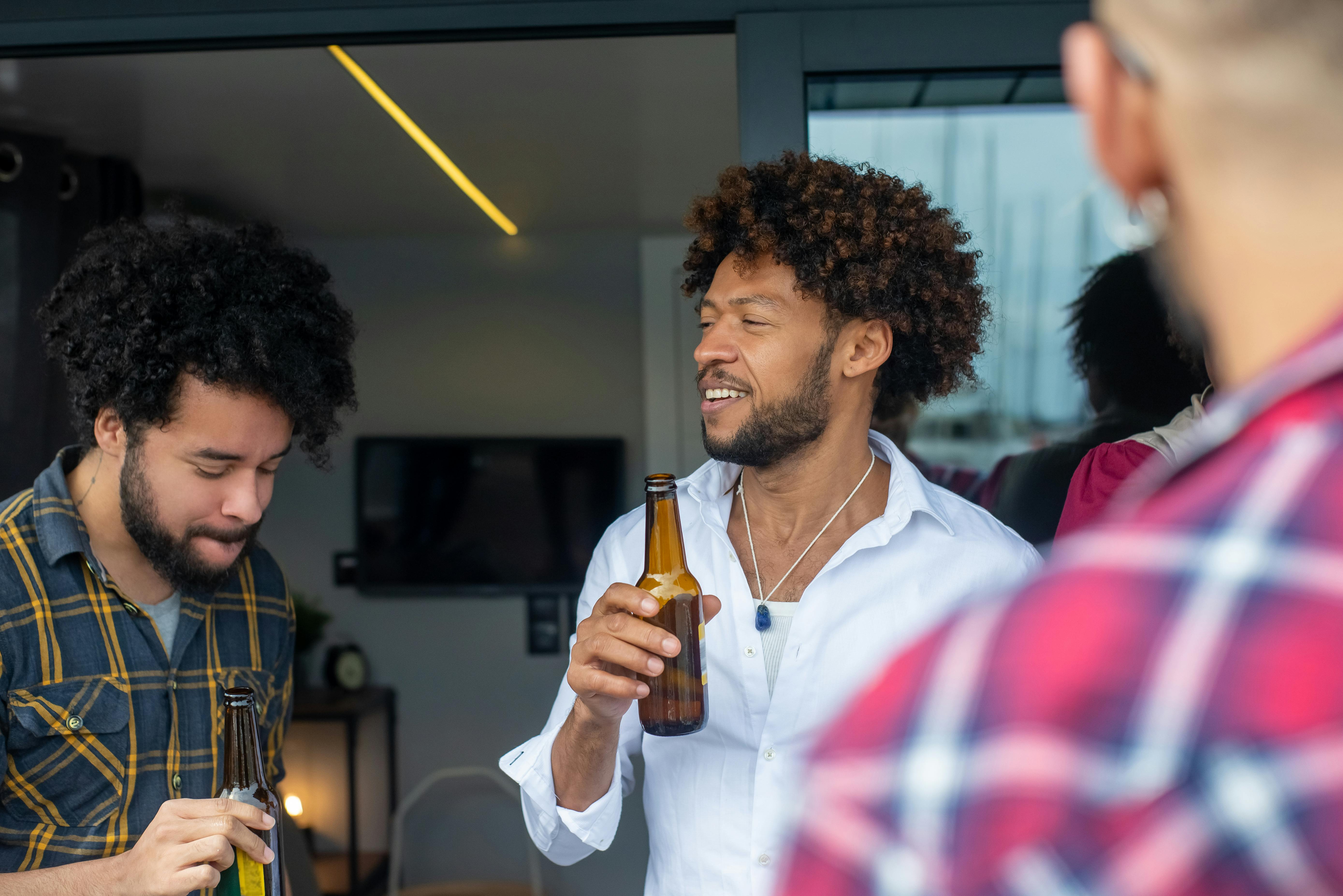 Men Having Beers Aboard a Boat · Free Stock Photo