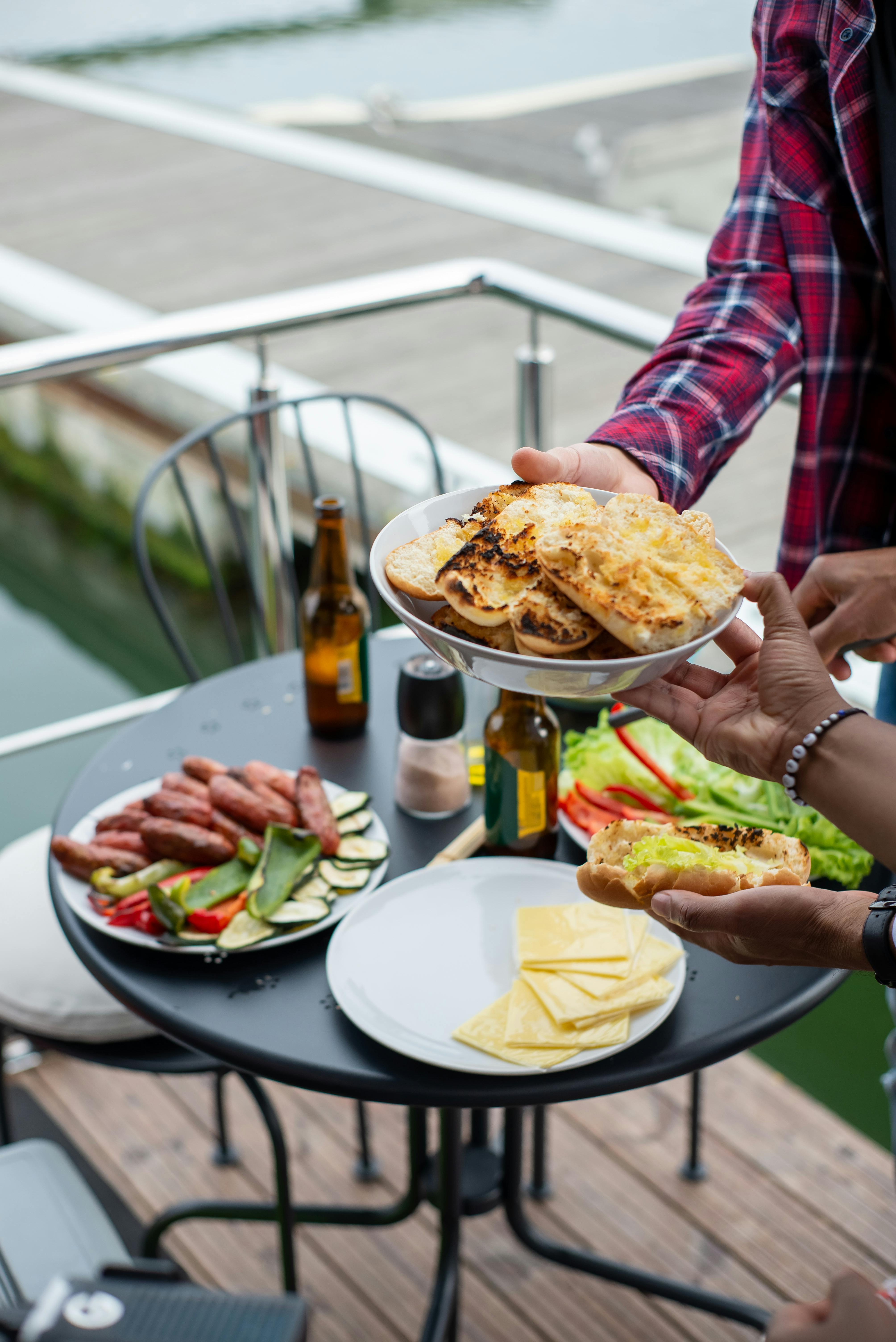 A Person Making a Burger · Free Stock Photo