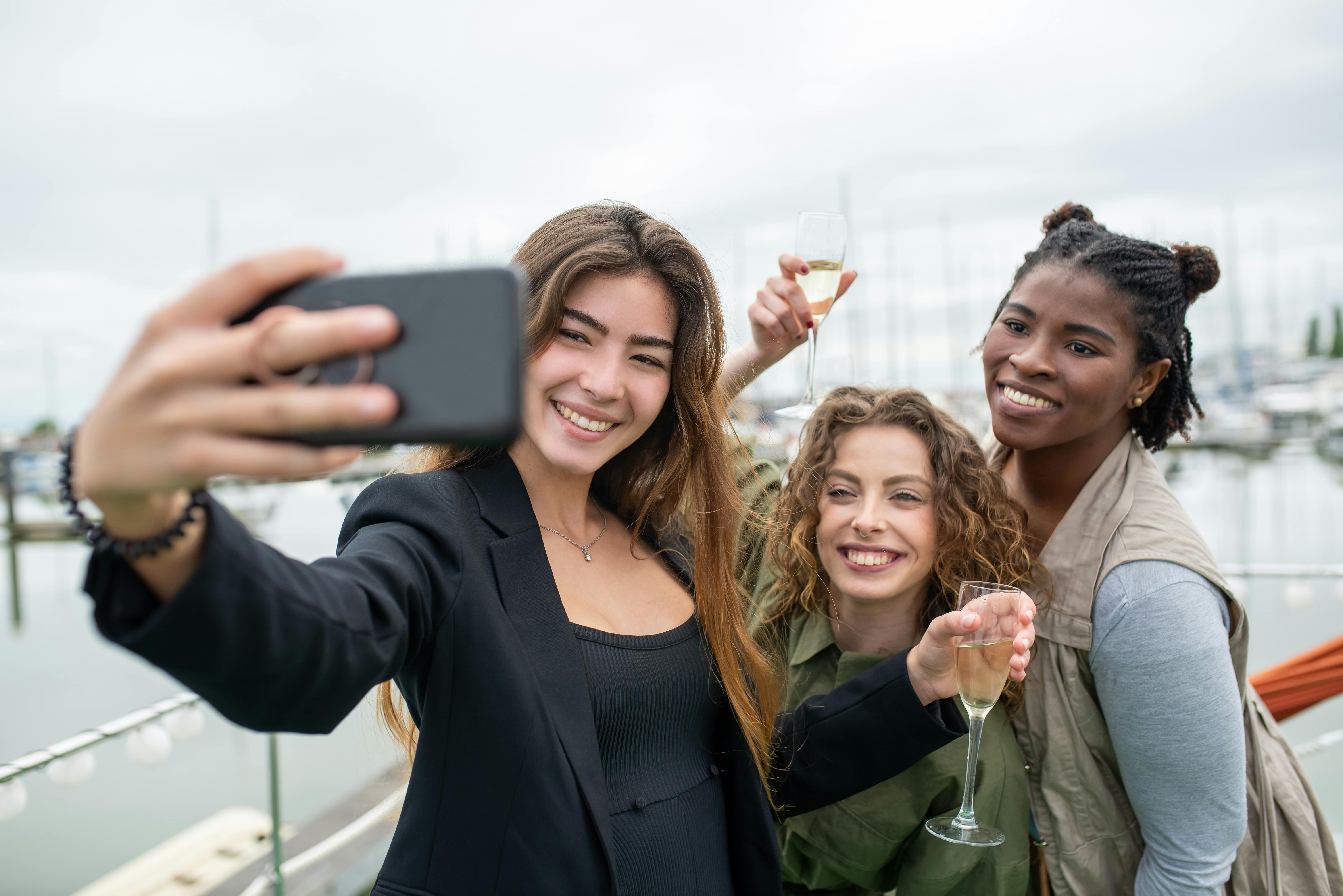 Photo of a Group of Friends Taking a Groupie · Free Stock Photo