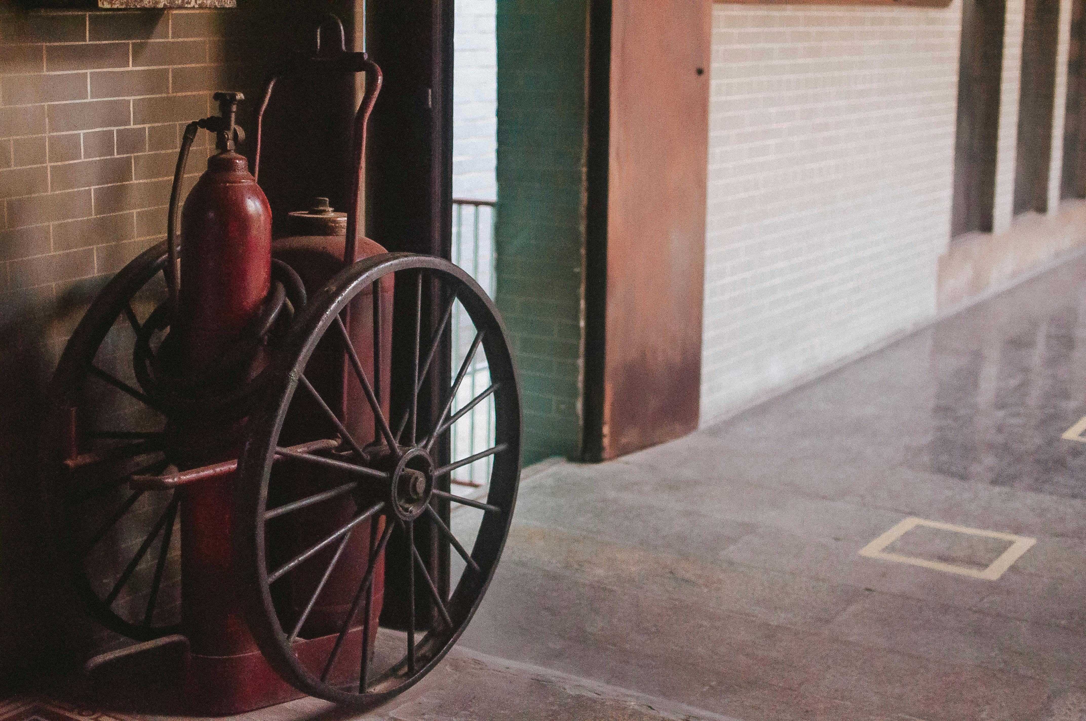 Fire Extinguisher on Wheels in Corridor · Free Stock Photo