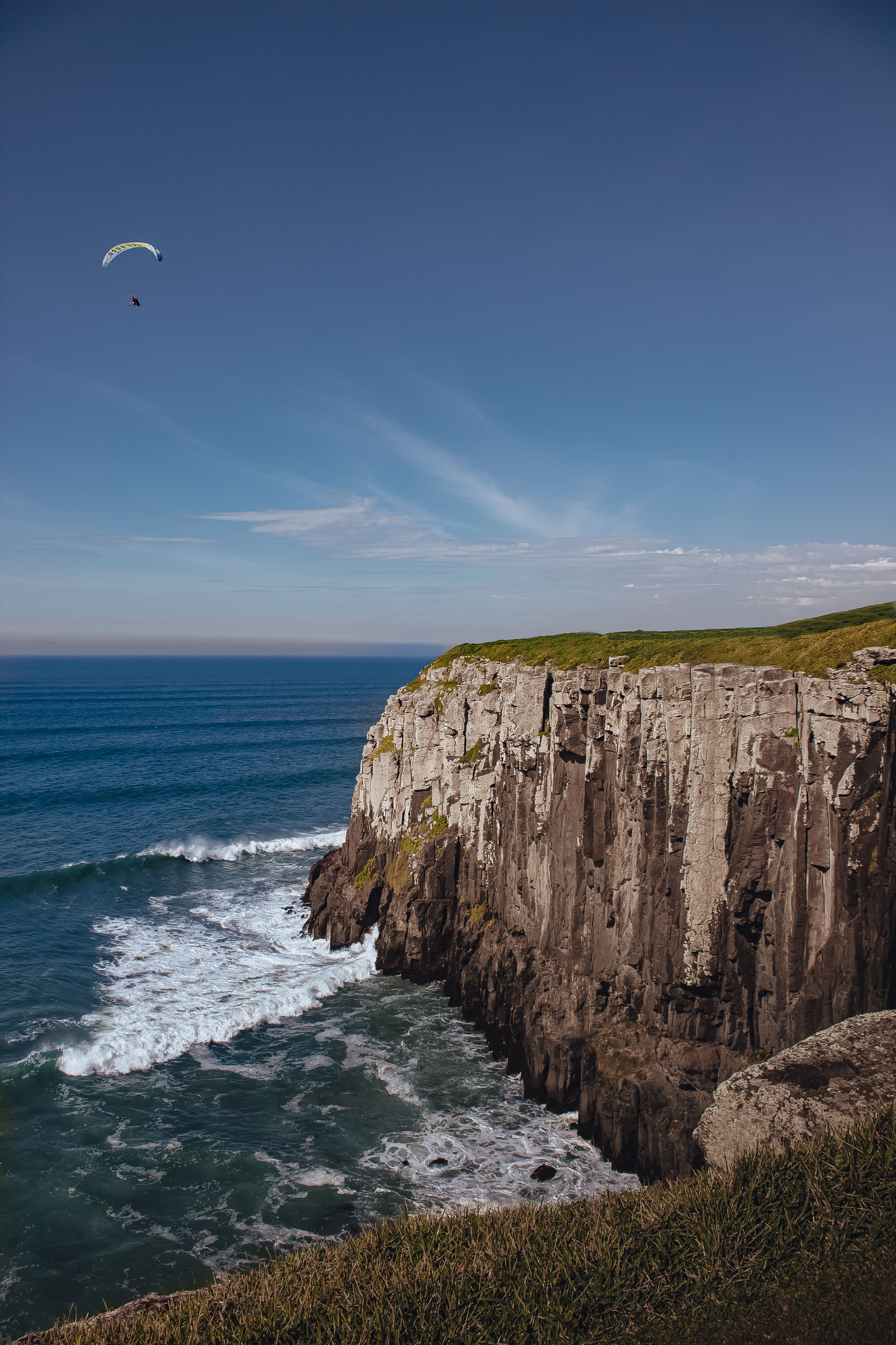 Blue Ocean Water Near Cliff Coast · Free Stock Photo