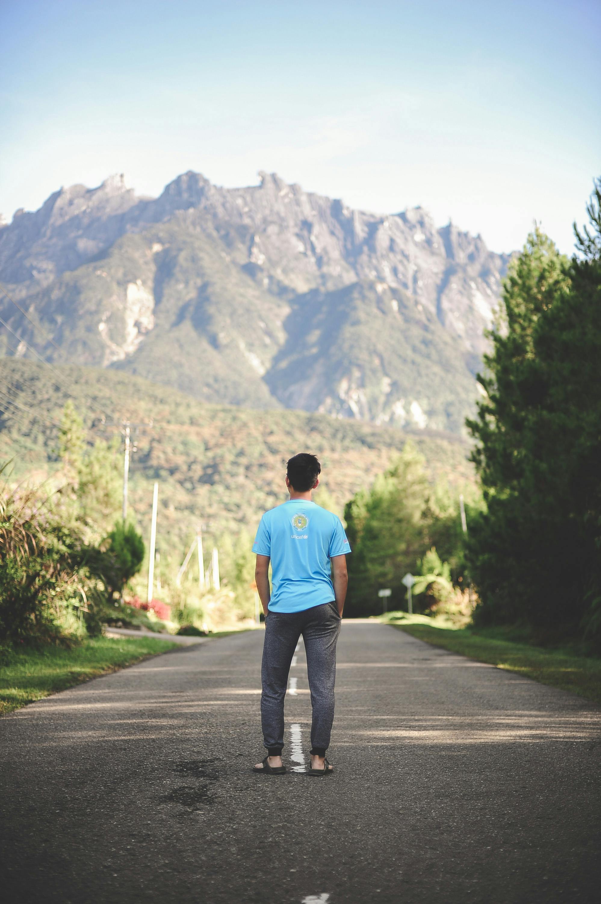 Man Standing on Road · Free Stock Photo Man Standing on Road · Free Stock Photo