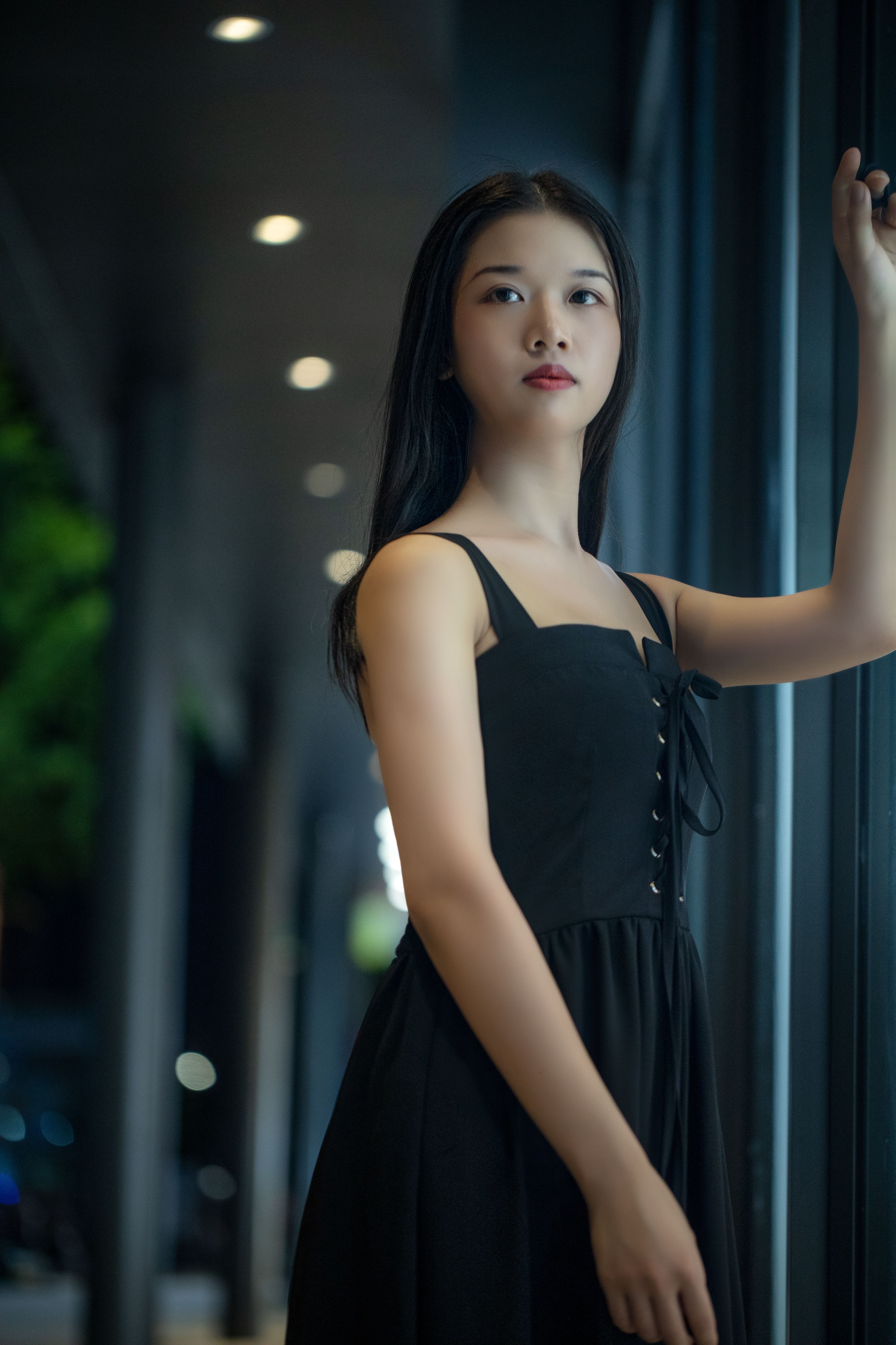Portrait of a Young Fashion Model Wearing a Black Dress · Free Stock Photo