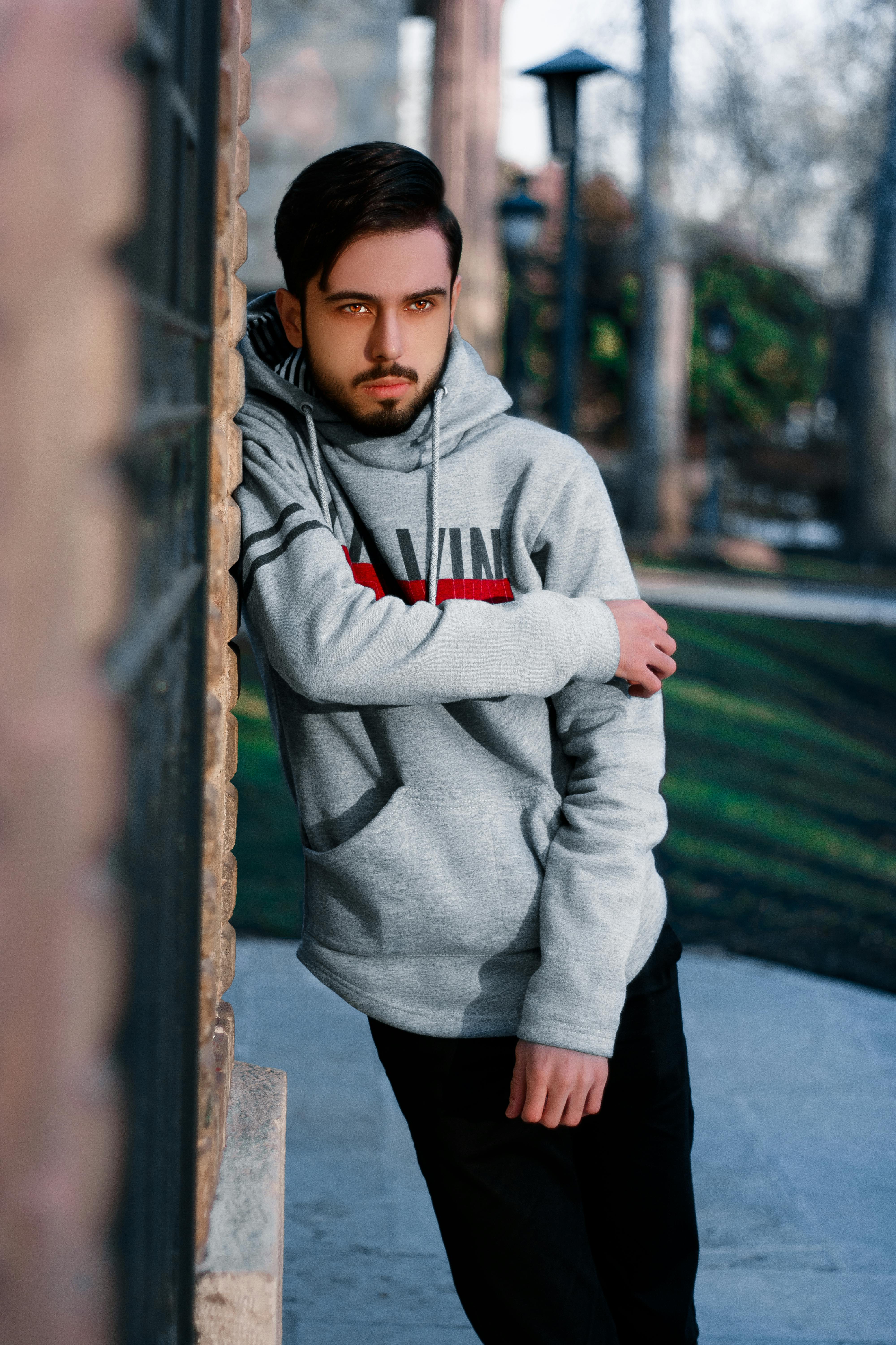 Man Posing by Wall · Free Stock Photo