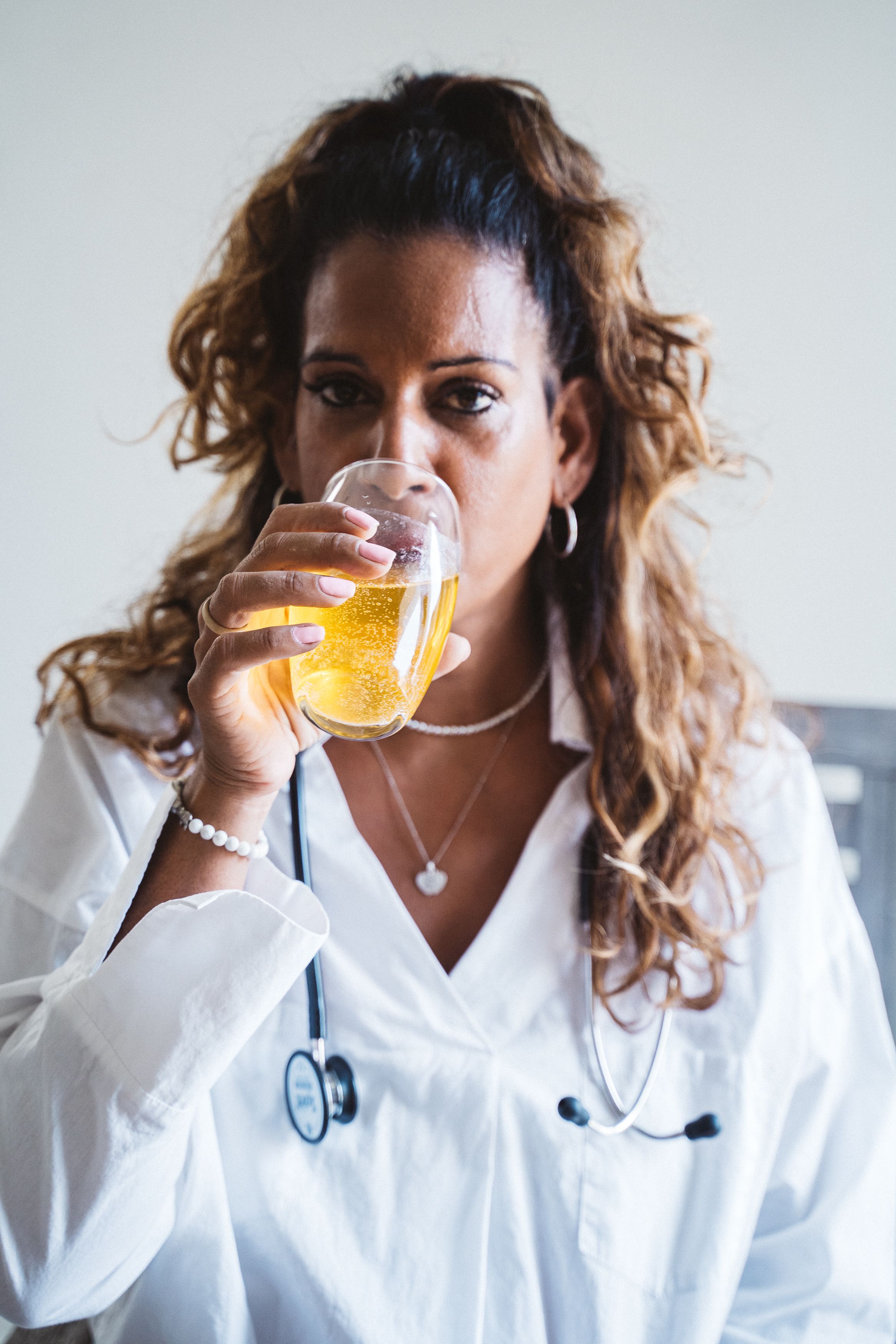 Doctor Drinking from Glass · Free Stock Photo