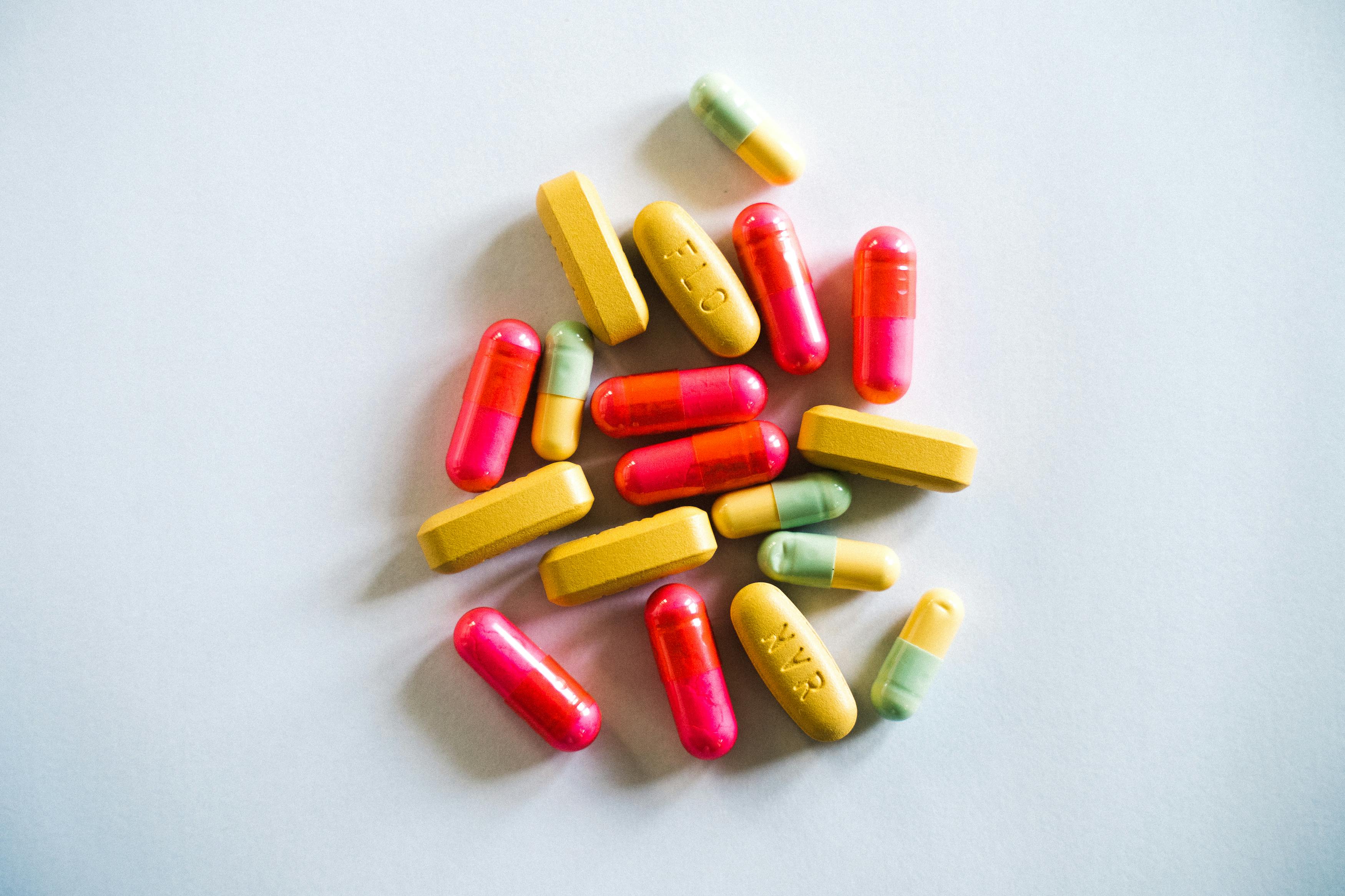Person Holding Medication Pill and Capsules · Free Stock Photo
