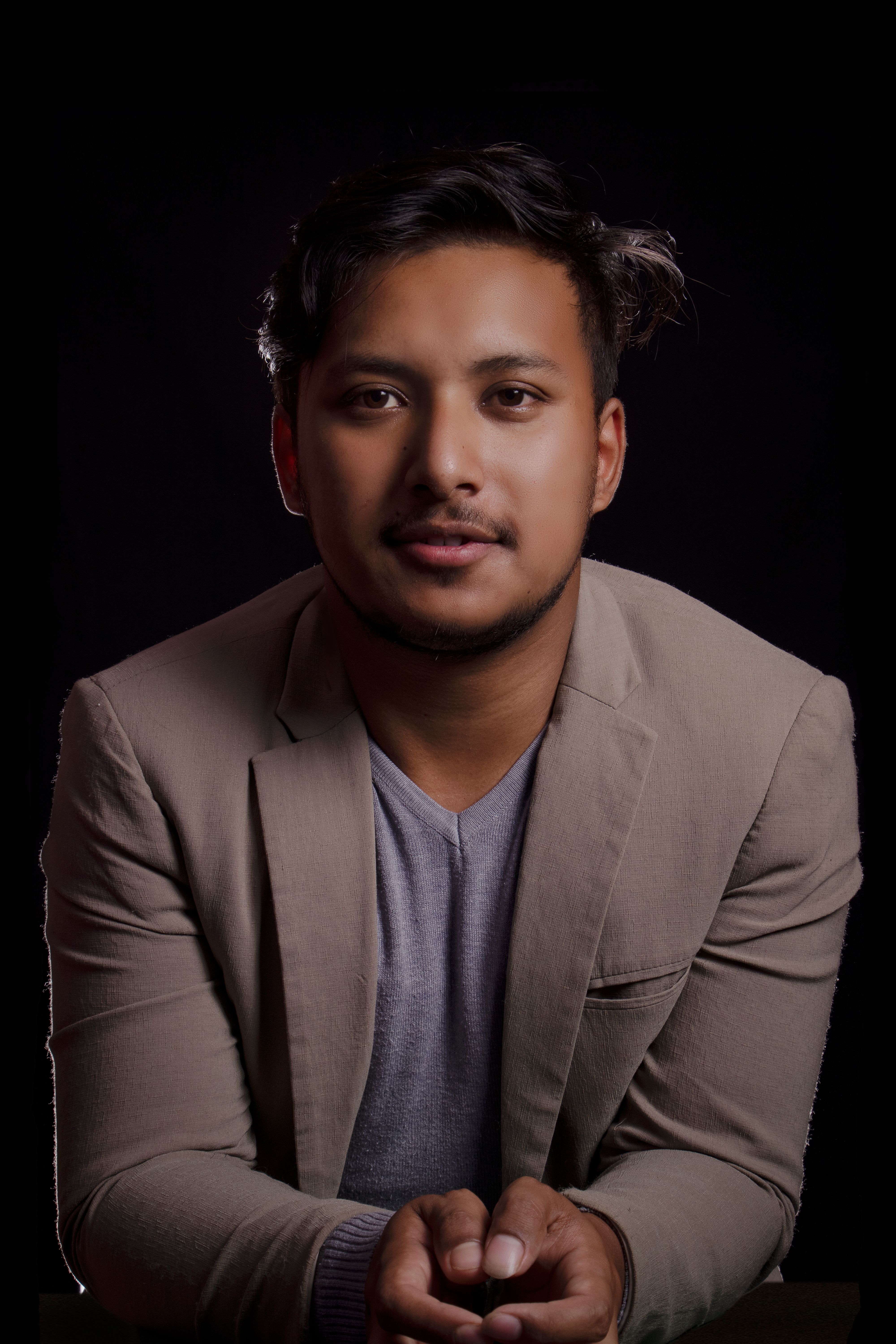 Good-Looking Man in a Suit Sitting with a Camera in his Hands · Free ...
