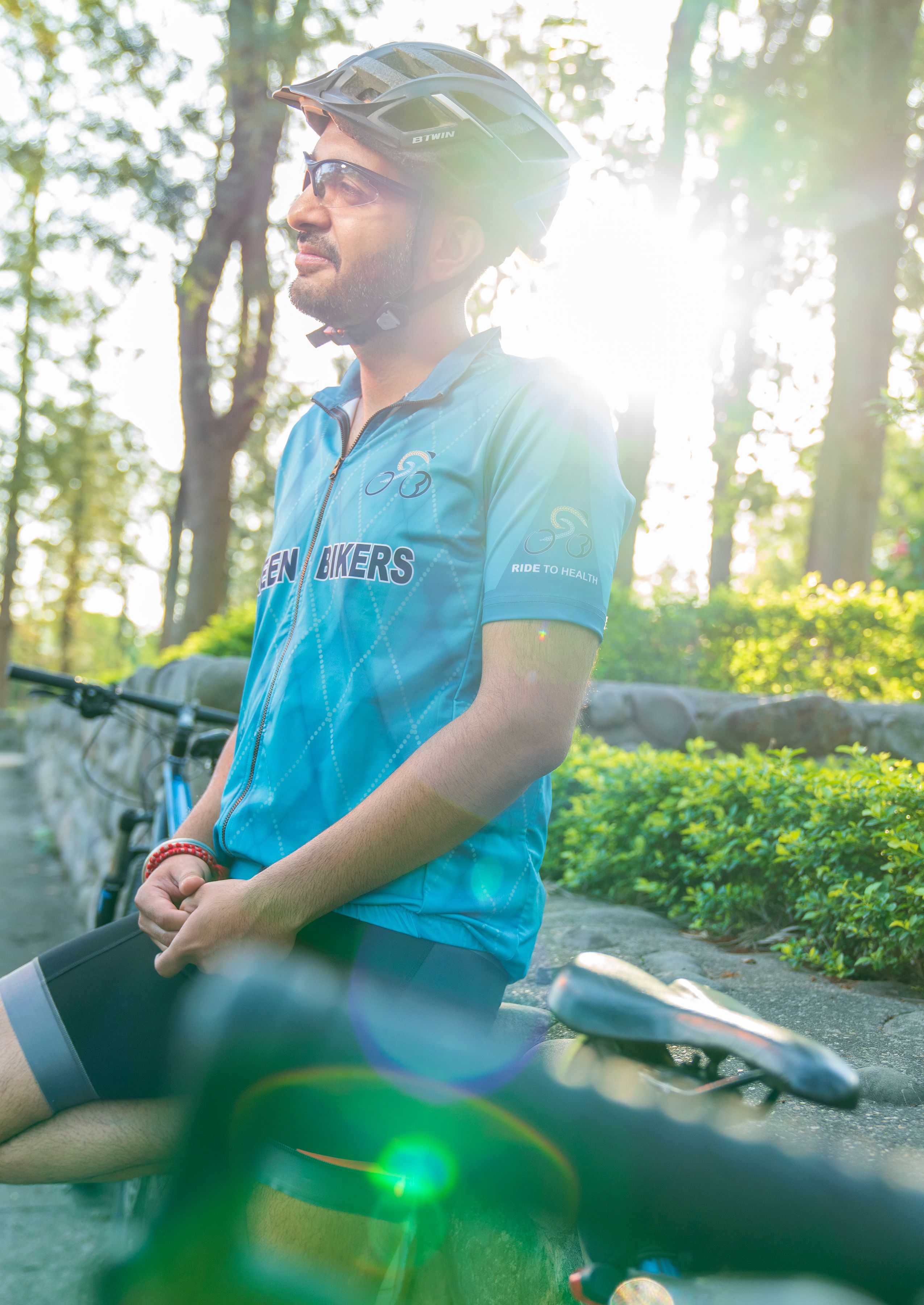 Man with Crossed Arms Wearing Bicycle Helmet · Free Stock Photo