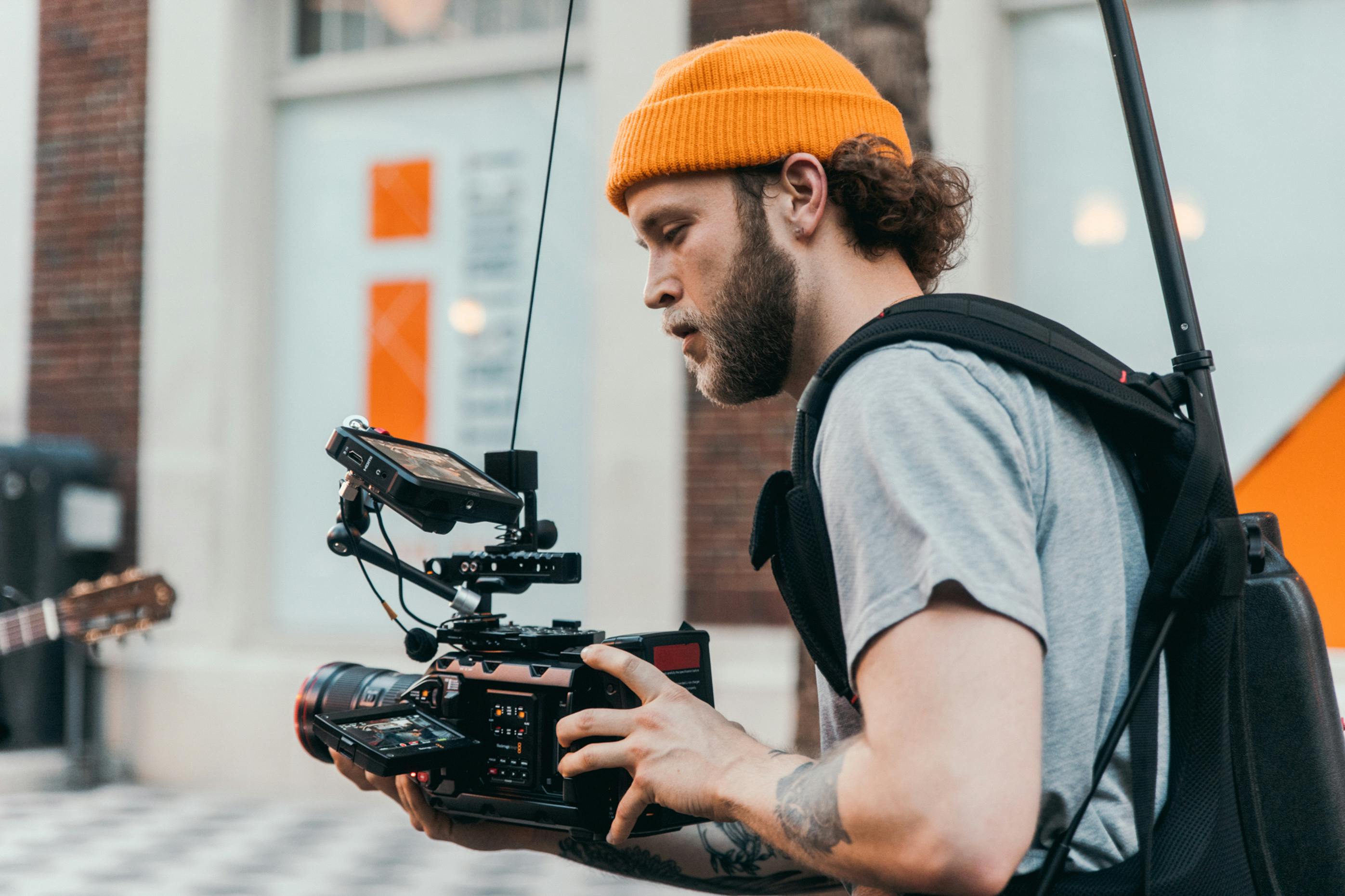 Photo of a Man Holding Video Camera · Free Stock Photo