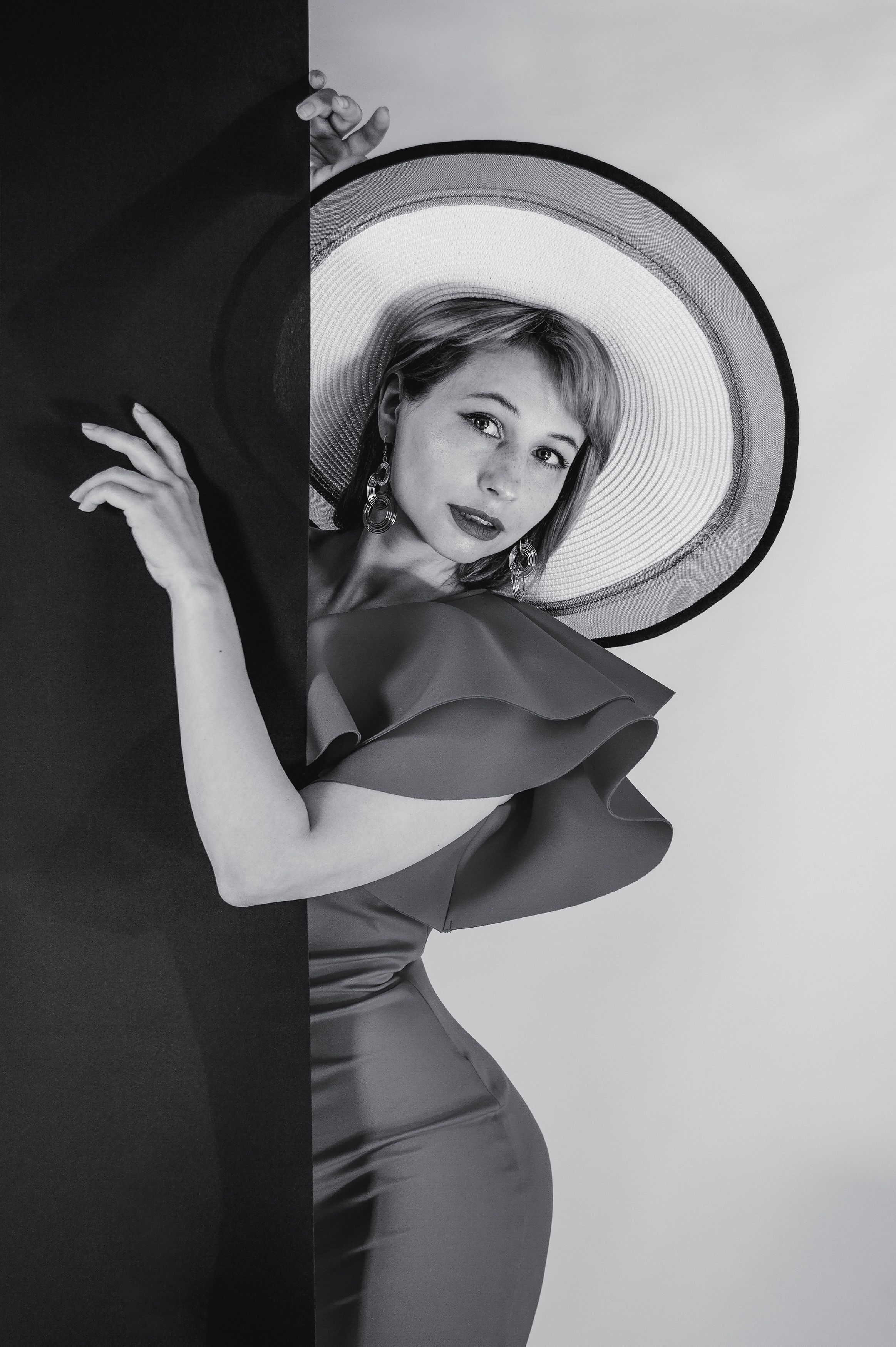 Grayscale Photo of a Woman in Gray Dress Posing · Free Stock Photo