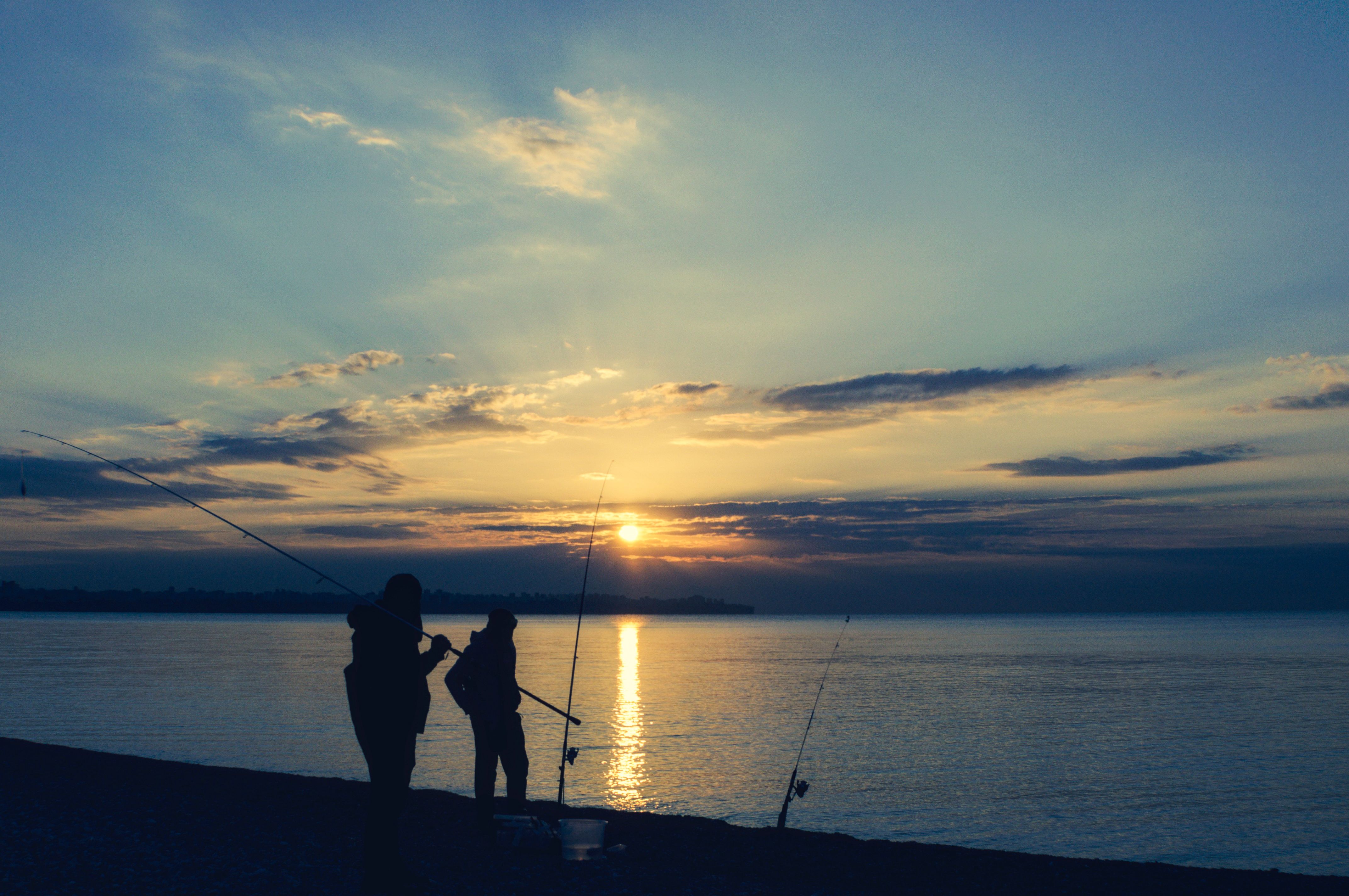 Silhouette of 2 People Fishing on Dock · Free Stock Photo